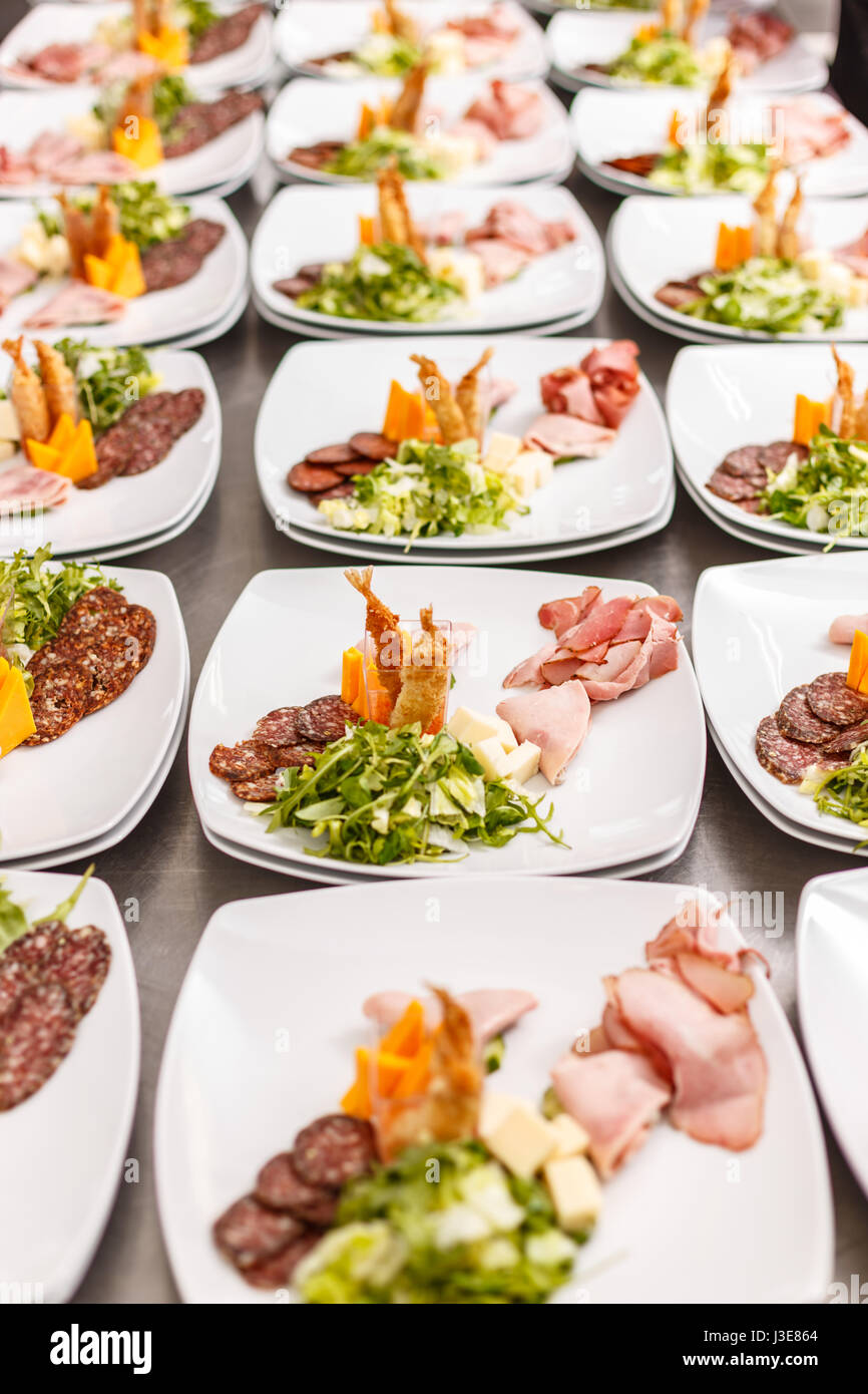Lot of appetizer plates being prepared in commercial kitchen Stock ...