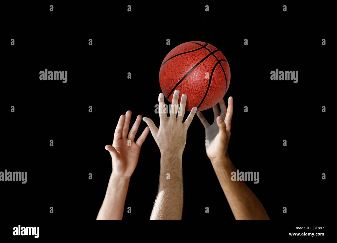 Players hand reaching for basketball in a competition Stock Photo - Alamy