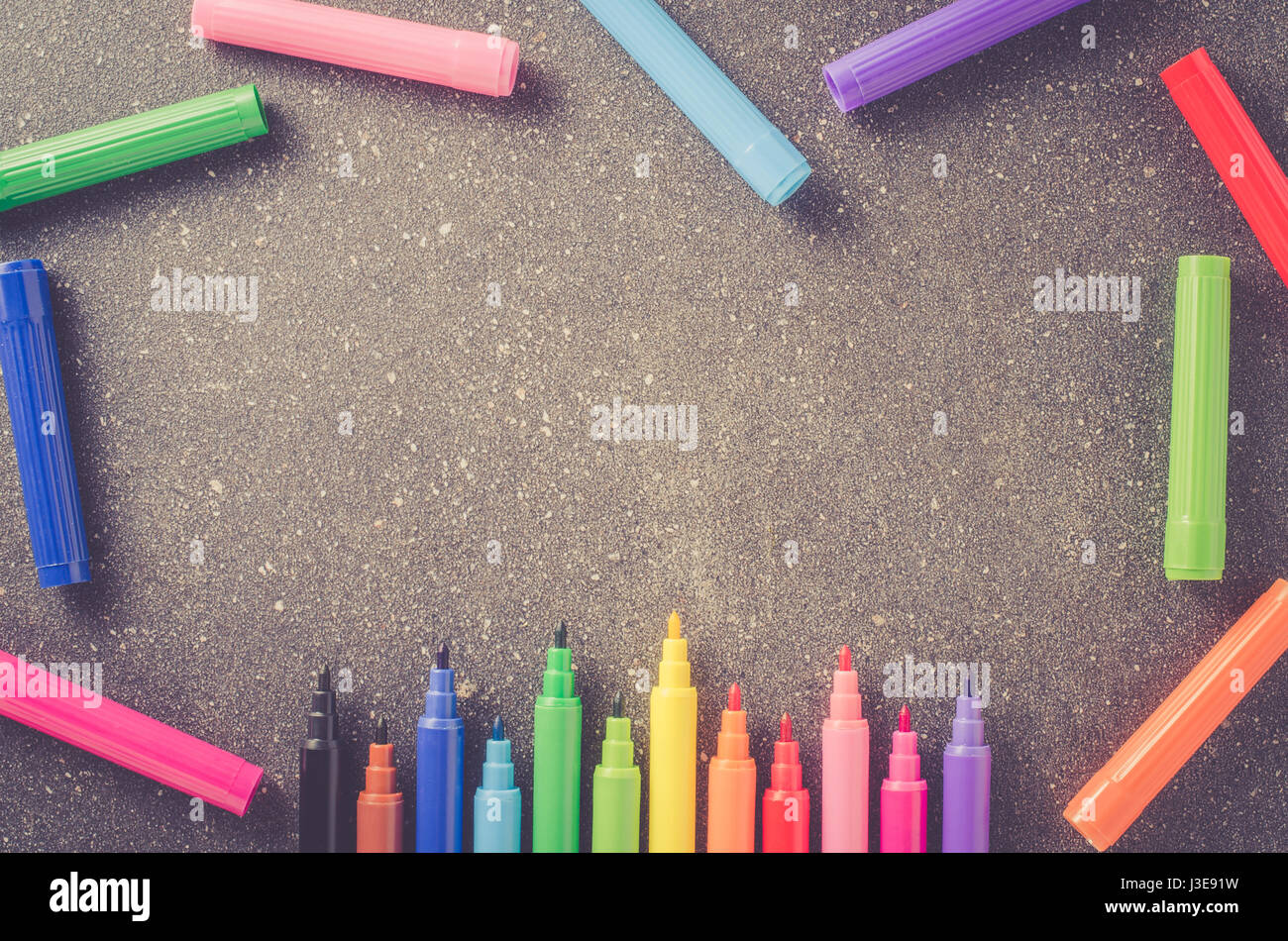 Colorful markers on dark background. Close up Stock Photo - Alamy