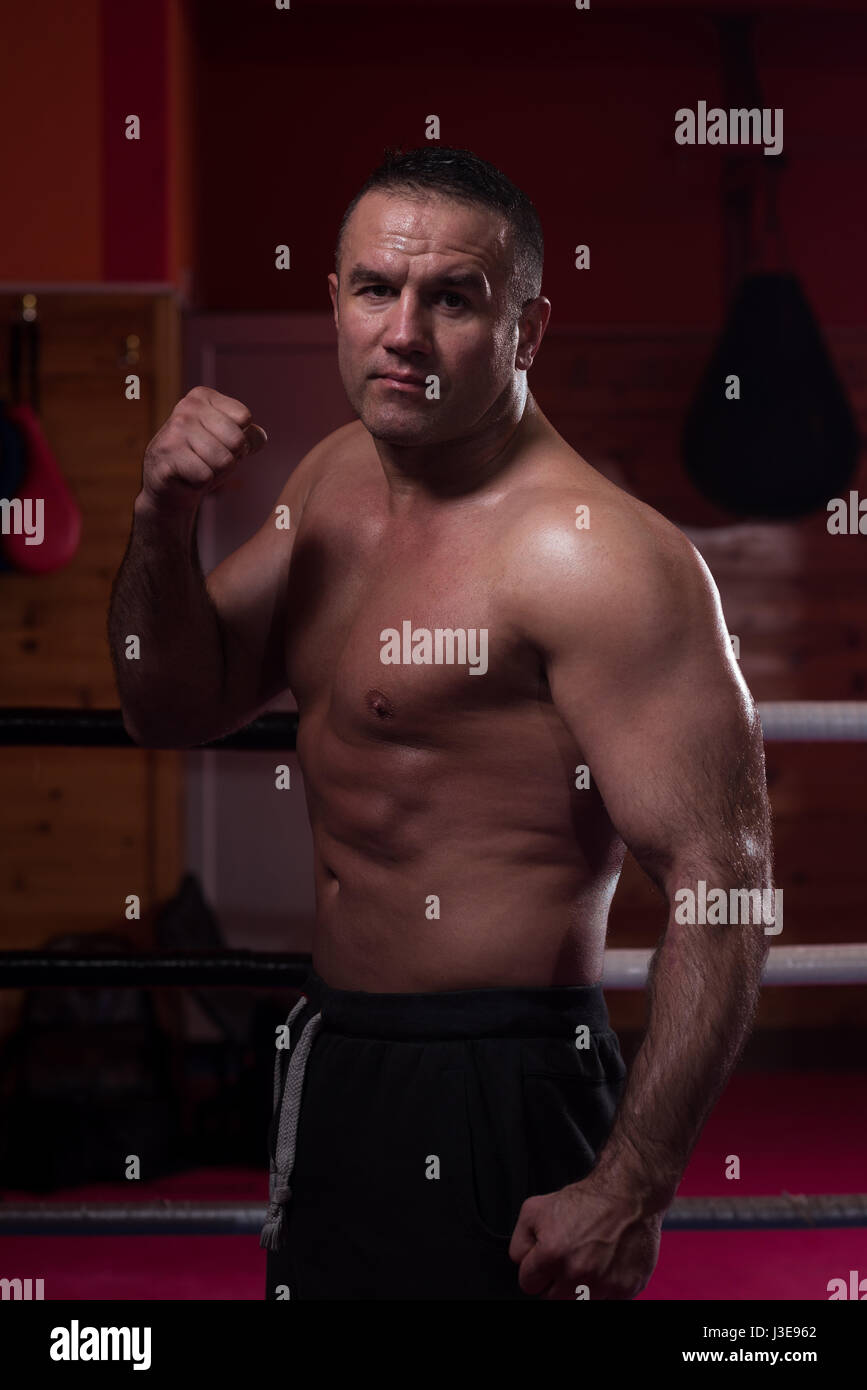 professional kickboxer with hands in martial arts position training for ...