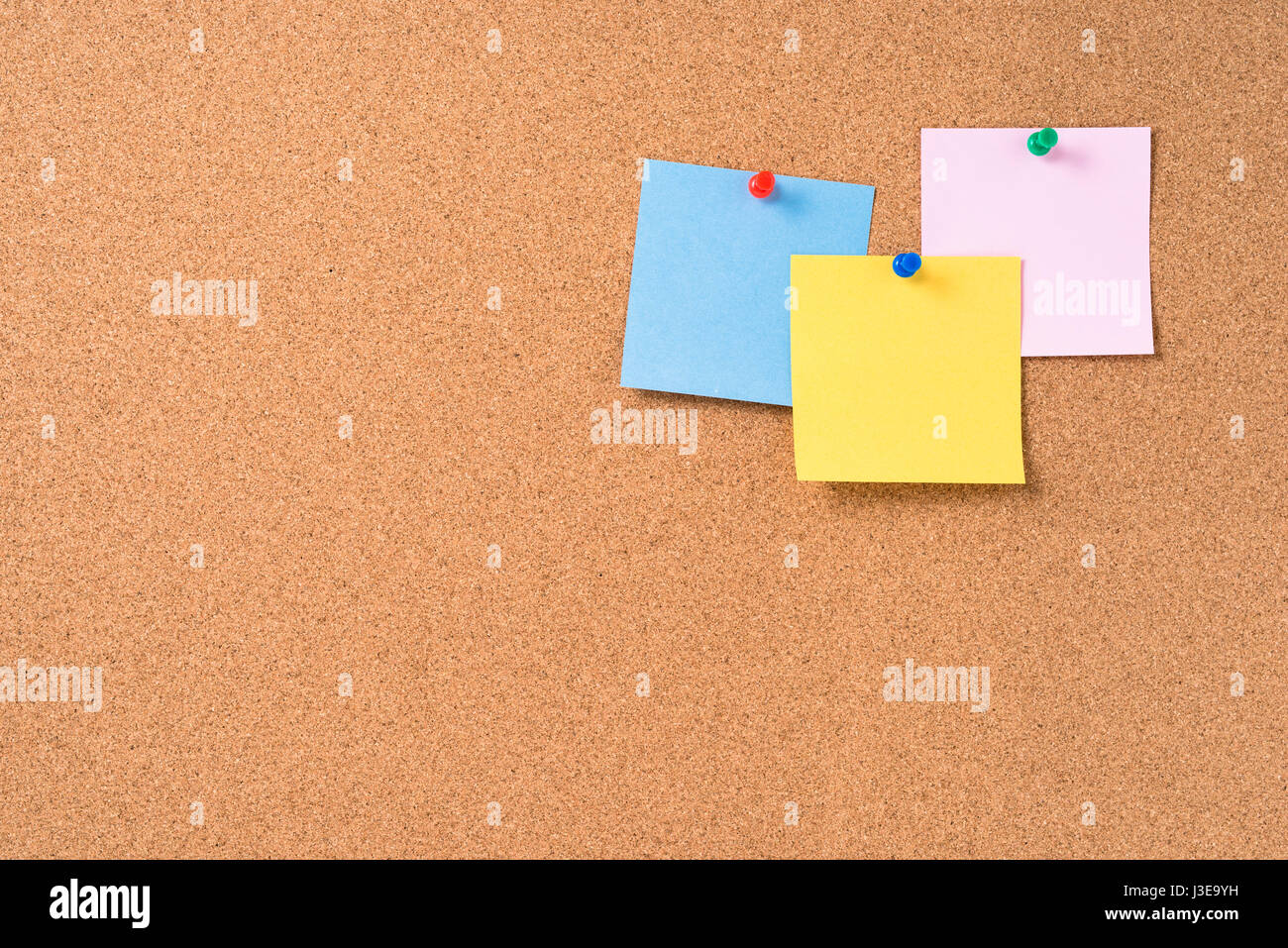 Cork board with colorful blank notes Stock Photo - Alamy