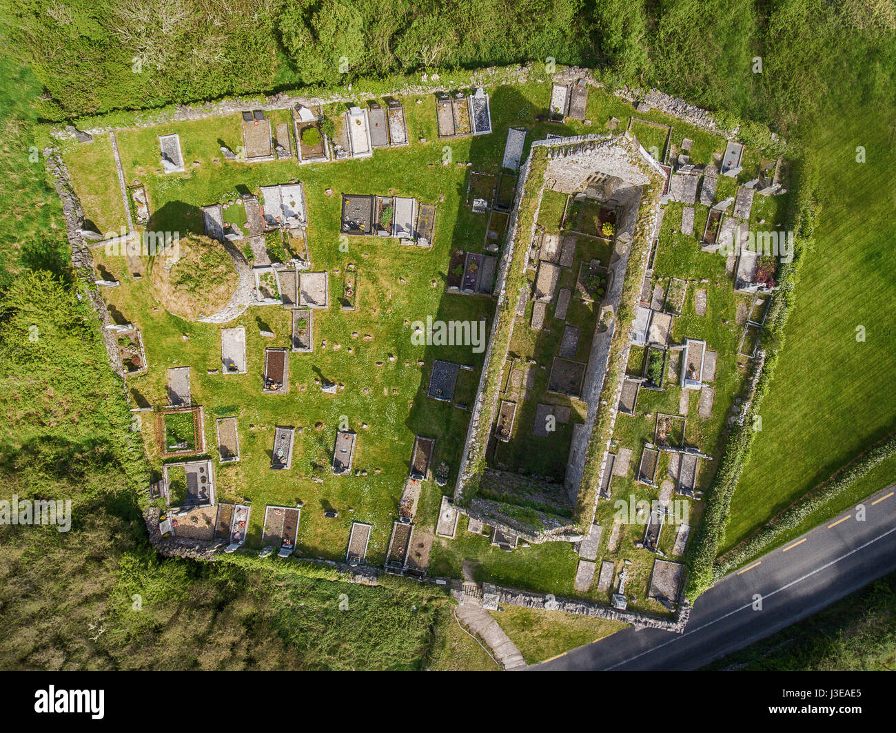 Aerial view of a beautiful old ruins of an Irish church and burial ...