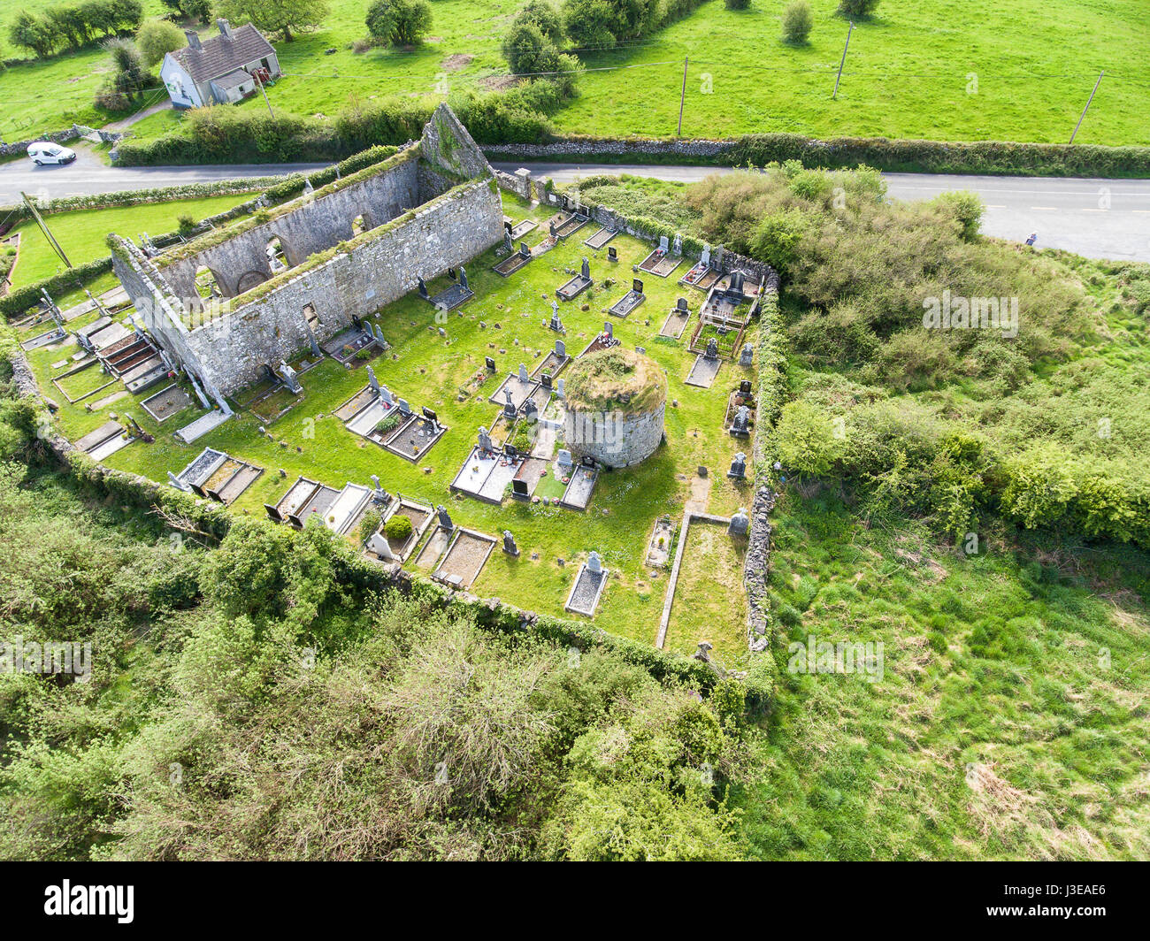 Aerial view of a beautiful old ruins of an Irish church and burial ...