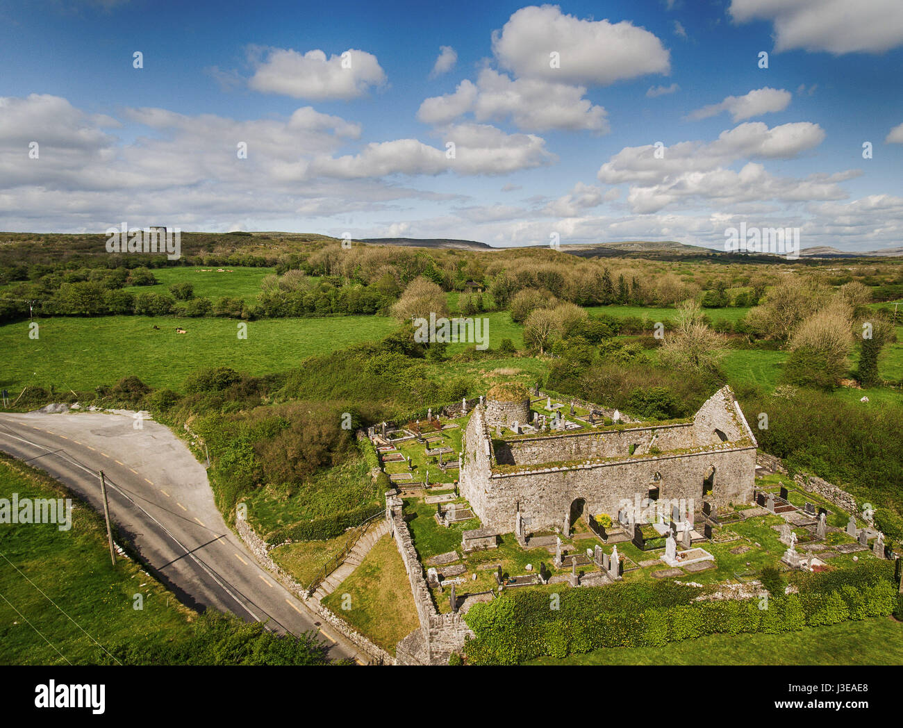 Aerial view of a beautiful old ruins of an Irish church and burial ...