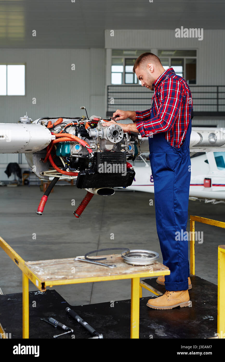 Airplane Engineer Fixing Turbine Stock Photo - Alamy