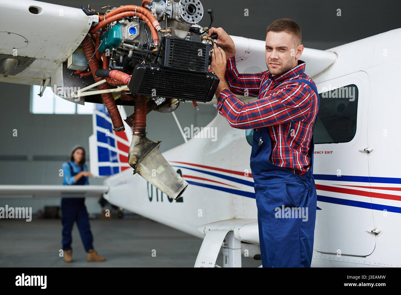 Engineers in jet aircraft hangar hi-res stock photography and images ...