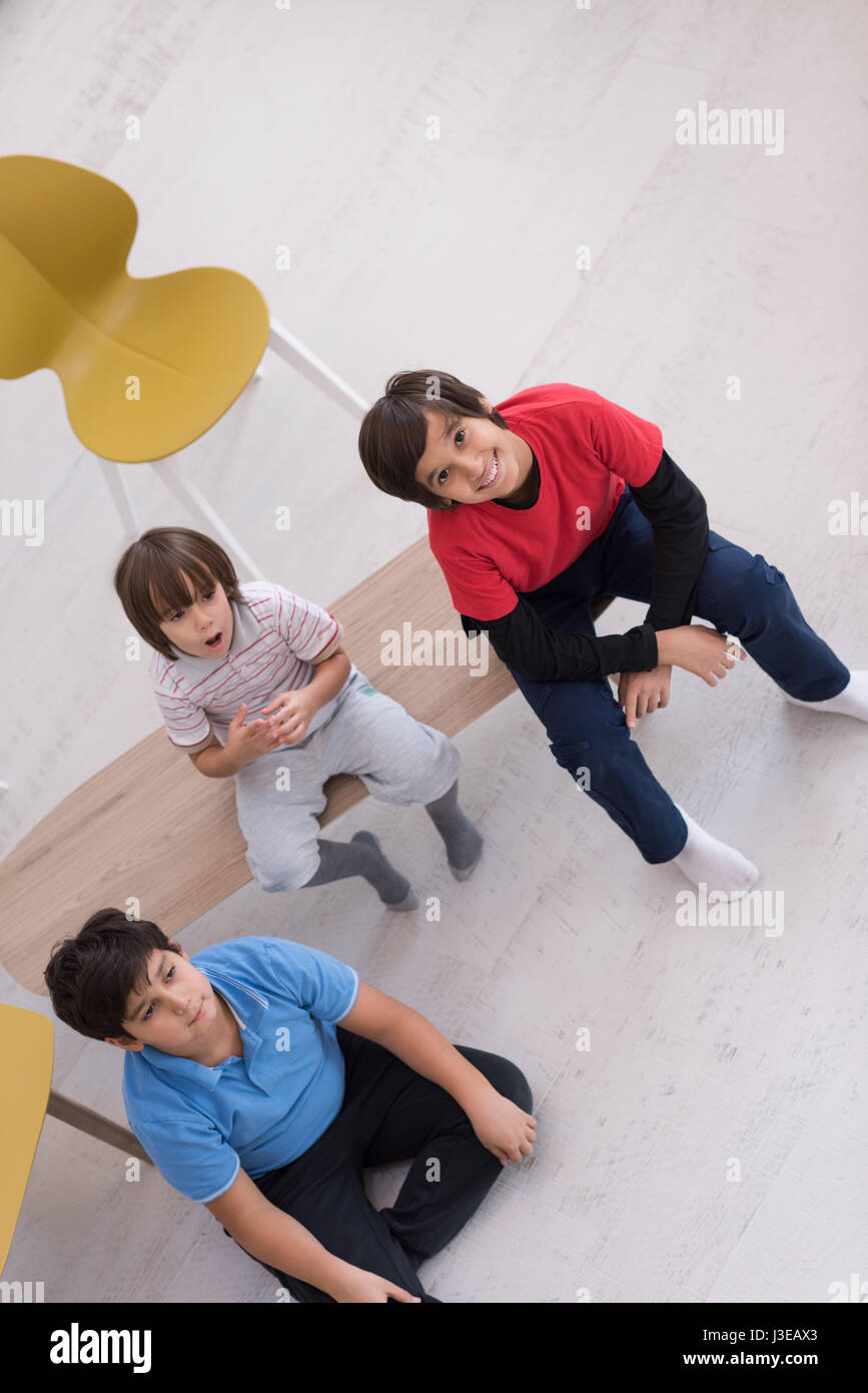 happy young boys enjoying their new modern home Stock Photo - Alamy