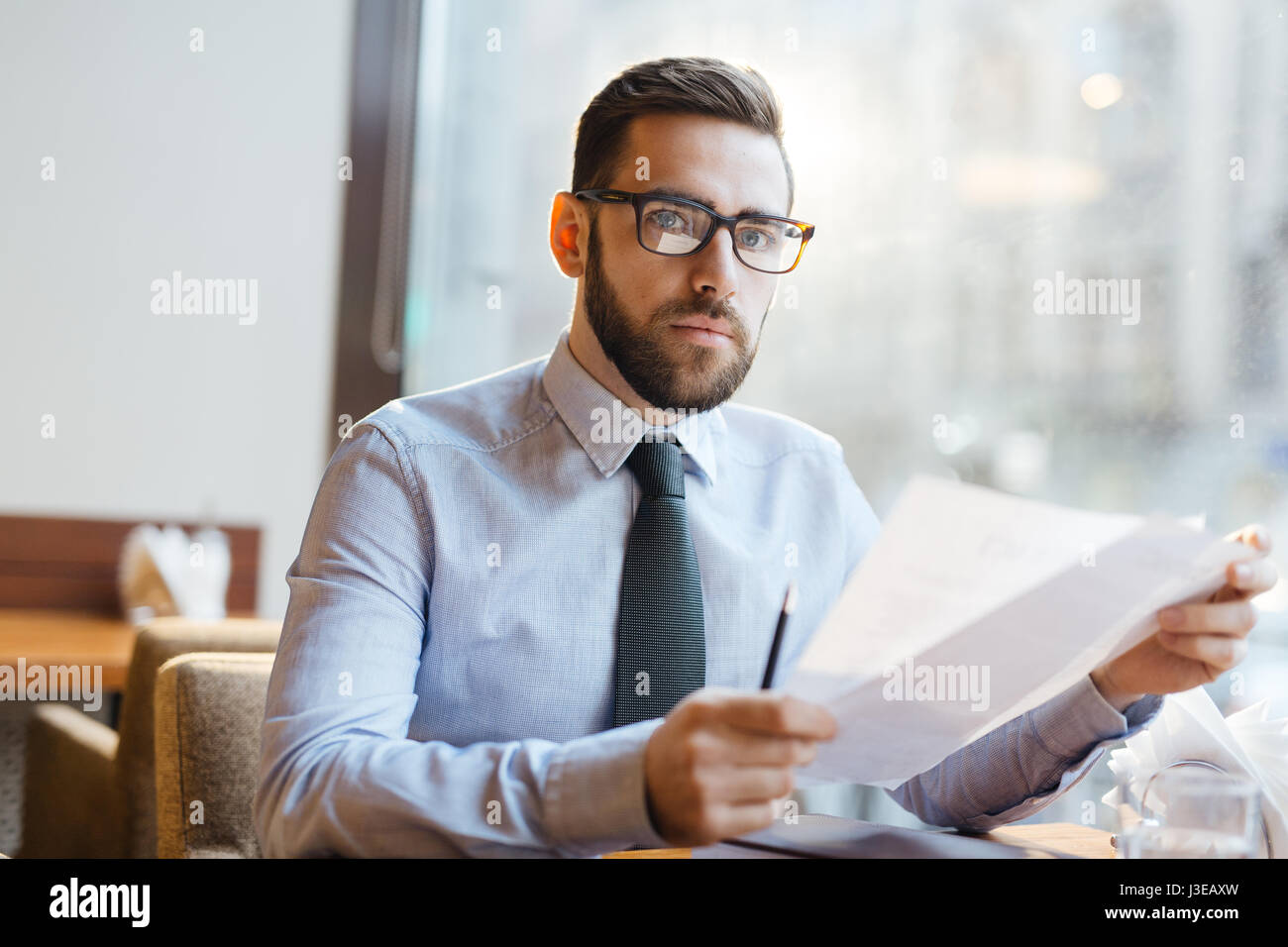 Man with documents Stock Photo - Alamy