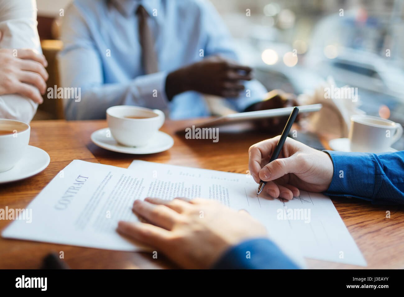 Signing business agreement hi-res stock photography and images - Alamy