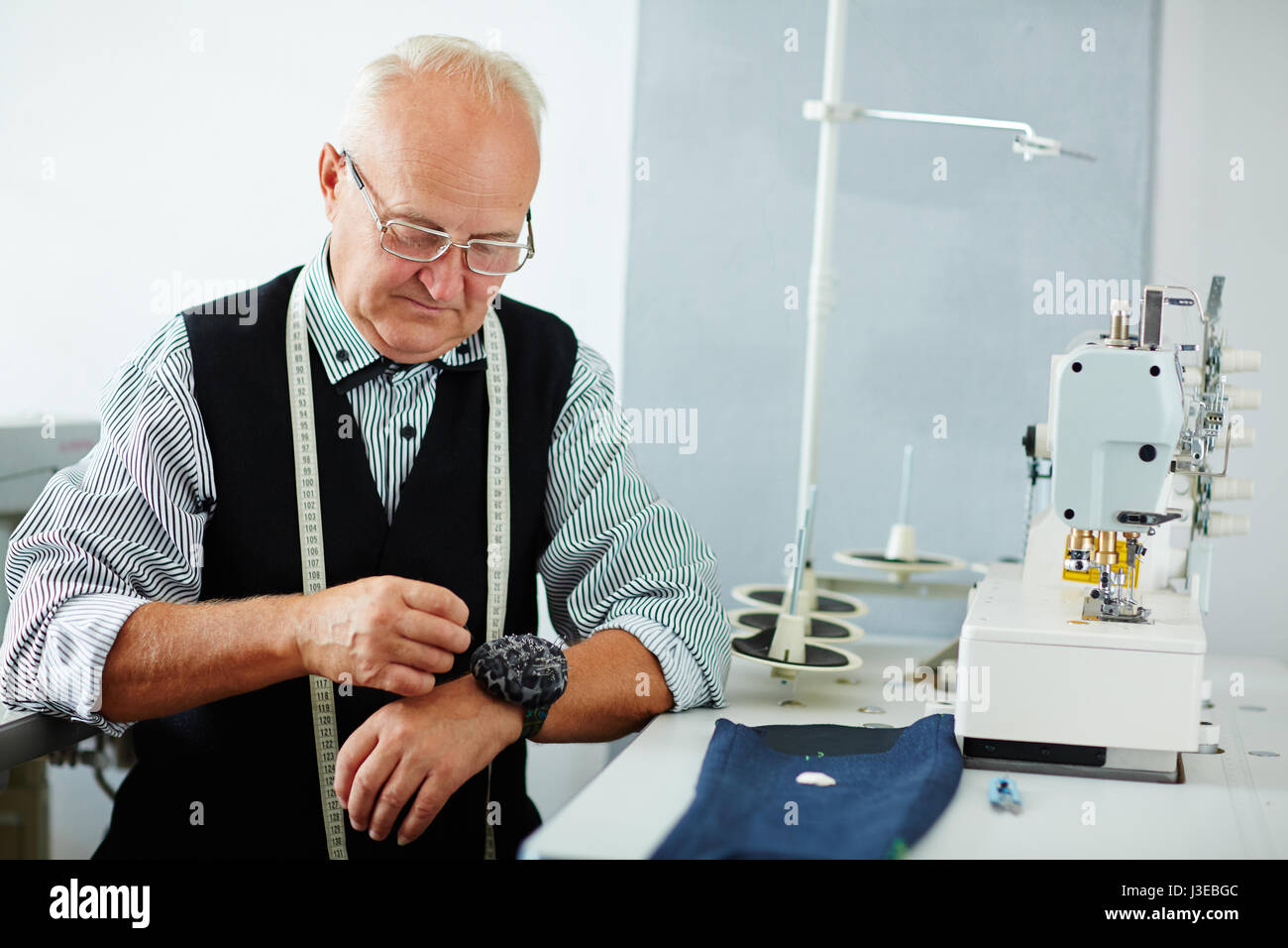 Old fashioned tailor in hi-res stock photography and images - Alamy