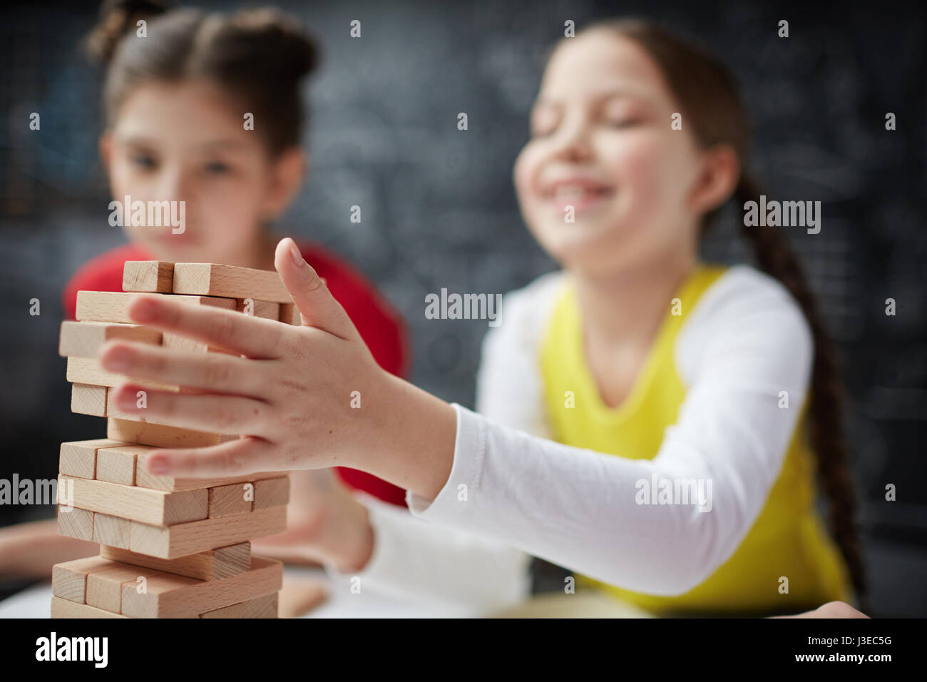 Girl build tower hi-res stock photography and images - Alamy