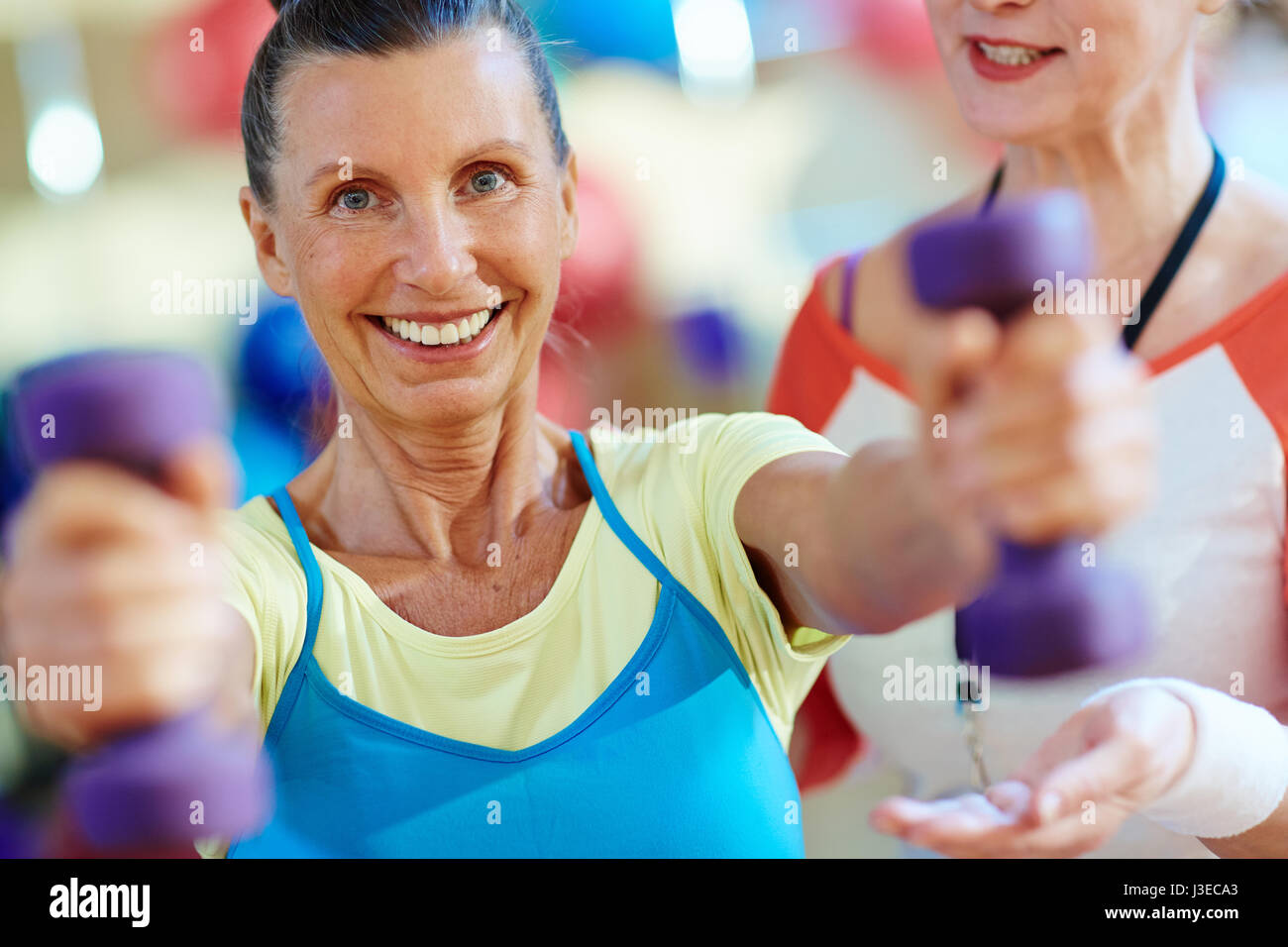 Exercising in gym Stock Photo - Alamy