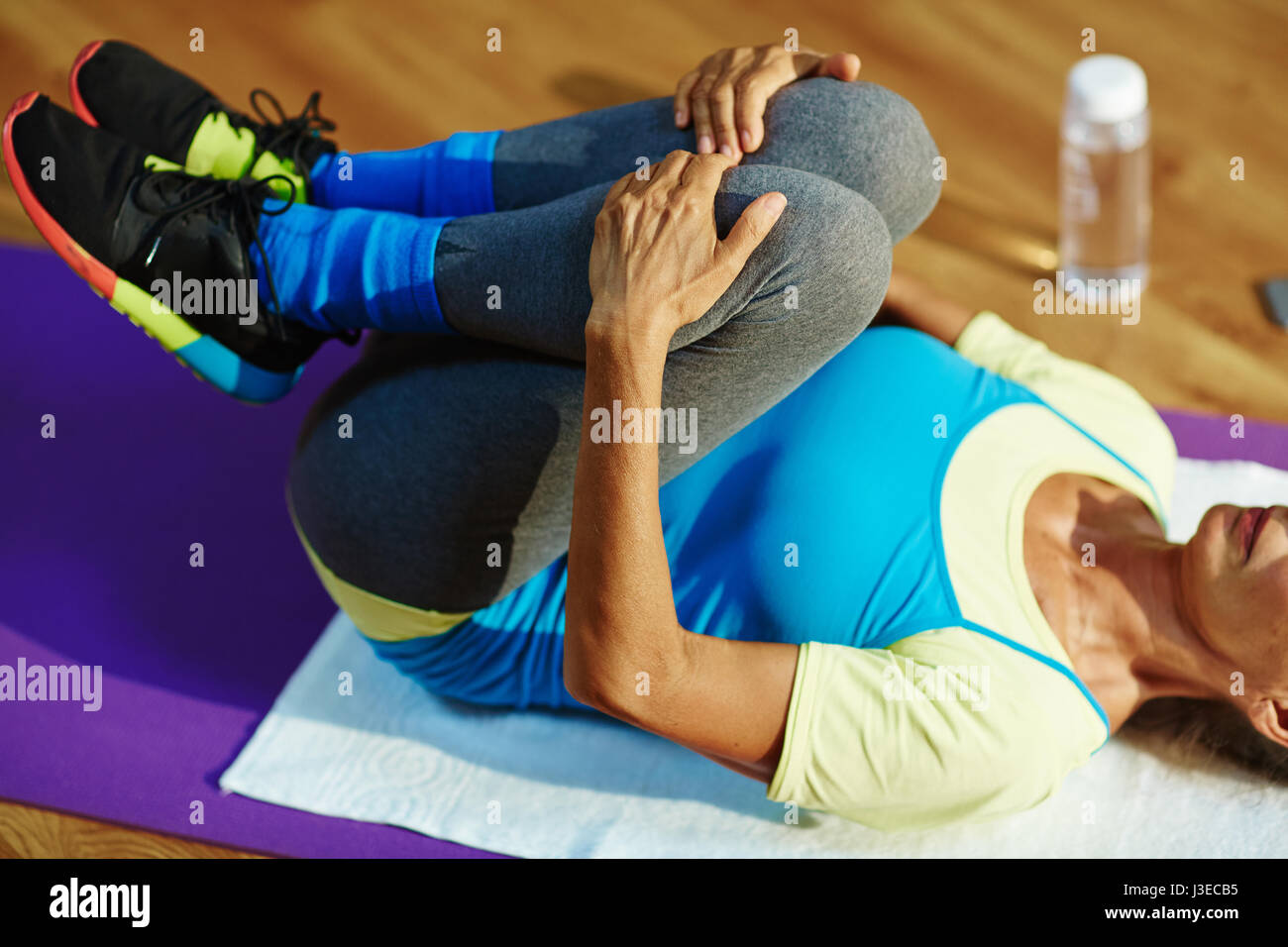 Senior woman lying on floor hi-res stock photography and images - Alamy
