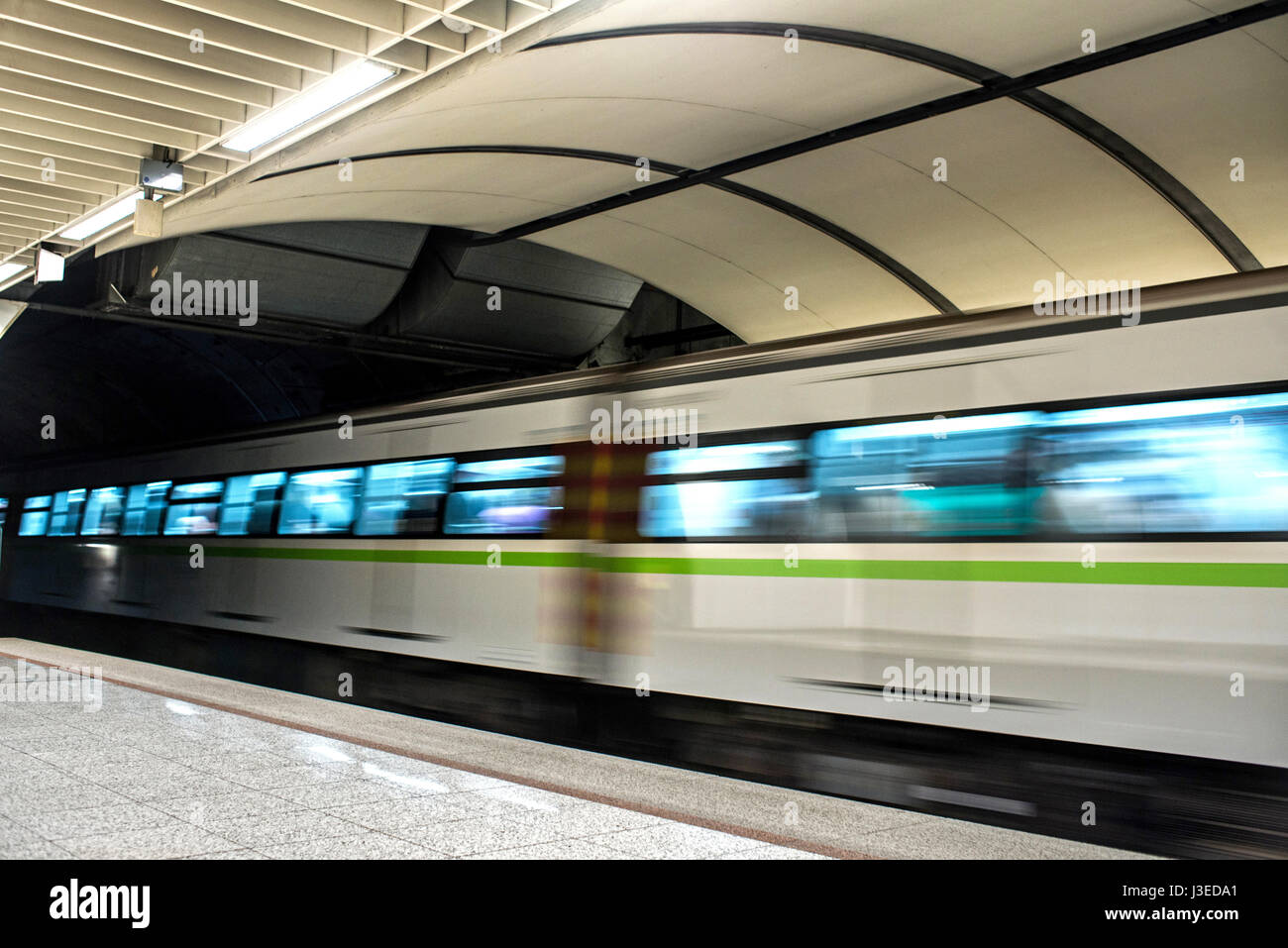Metro train speeding up in the subway Stock Photo - Alamy