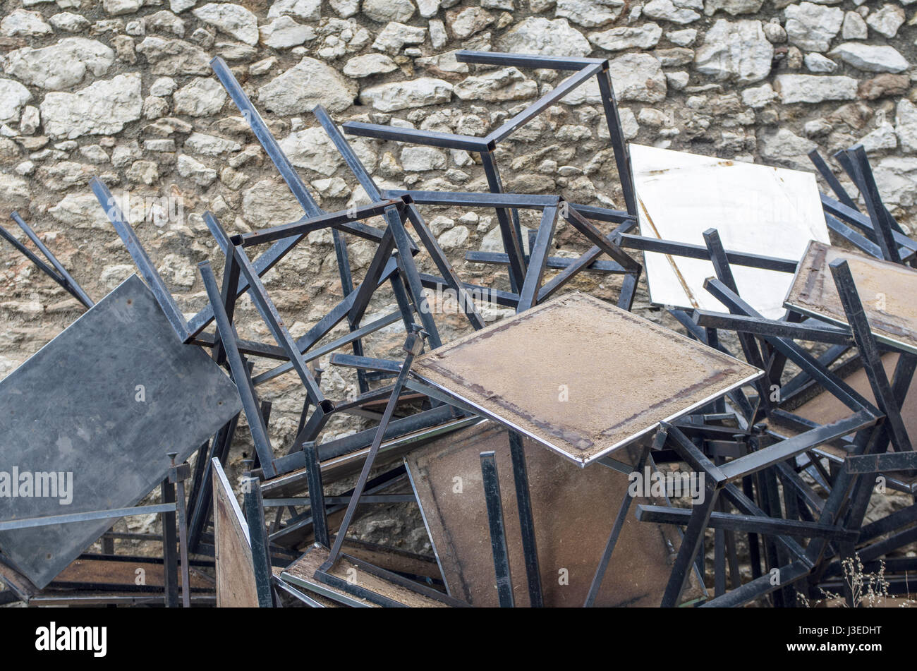 Old tables on a pile under natural lights Stock Photo - Alamy
