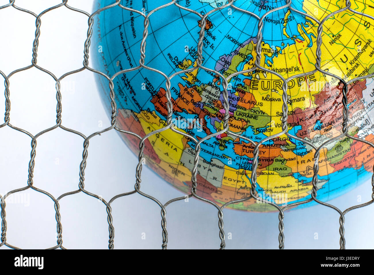 the global map behind a wire fence Stock Photo - Alamy