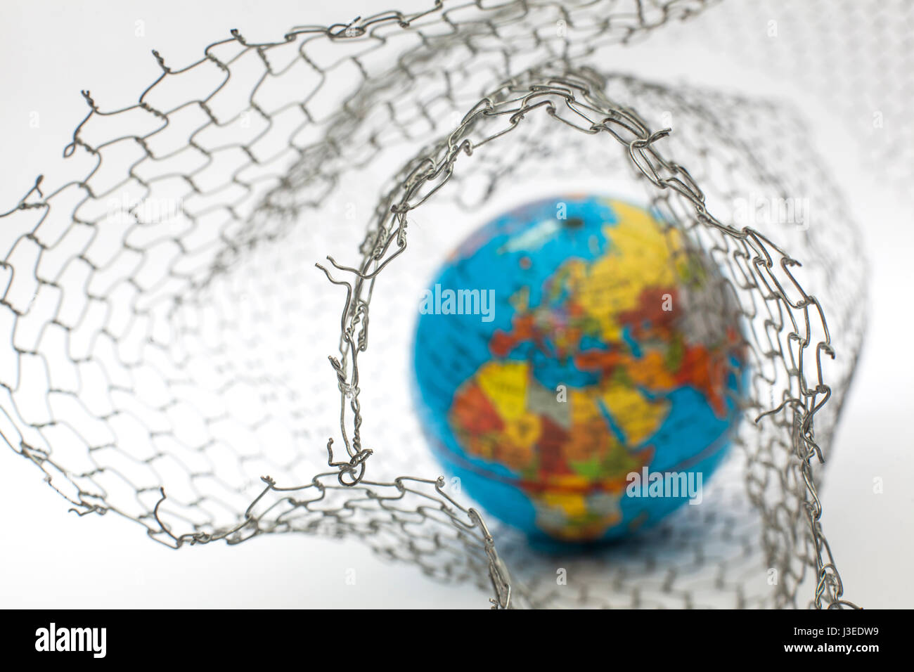 the global map in to a wire fence Stock Photo - Alamy