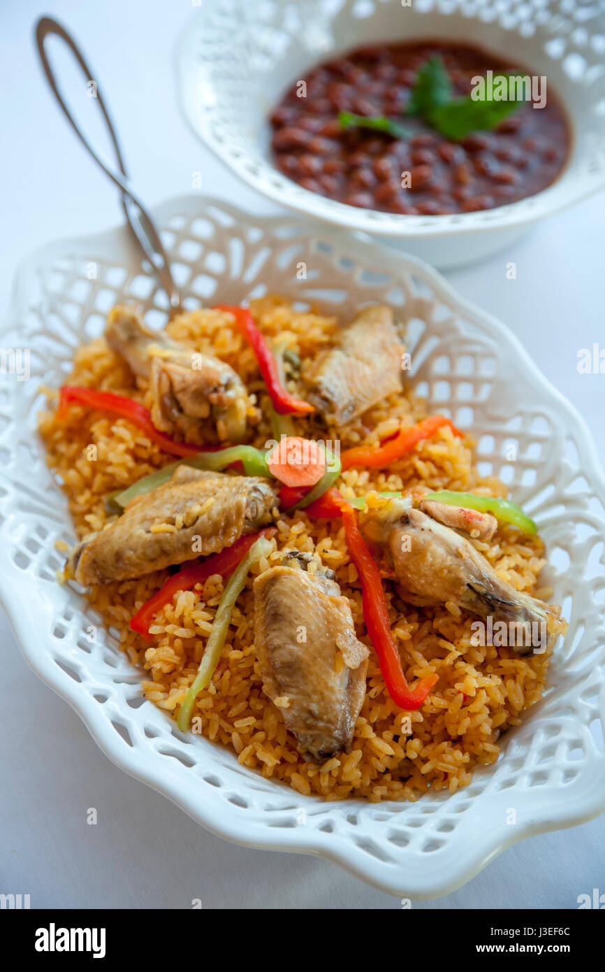 Arroz con pollo (chicken and rice) and side of beans, Puerto Rico Stock ...