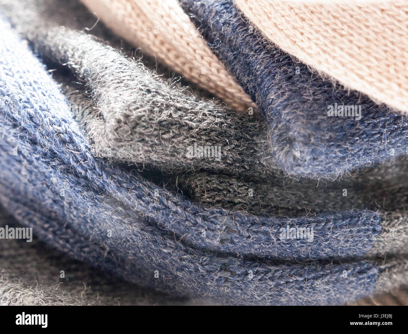 close up texture of warm soft socks made of cotton wool blue and ...