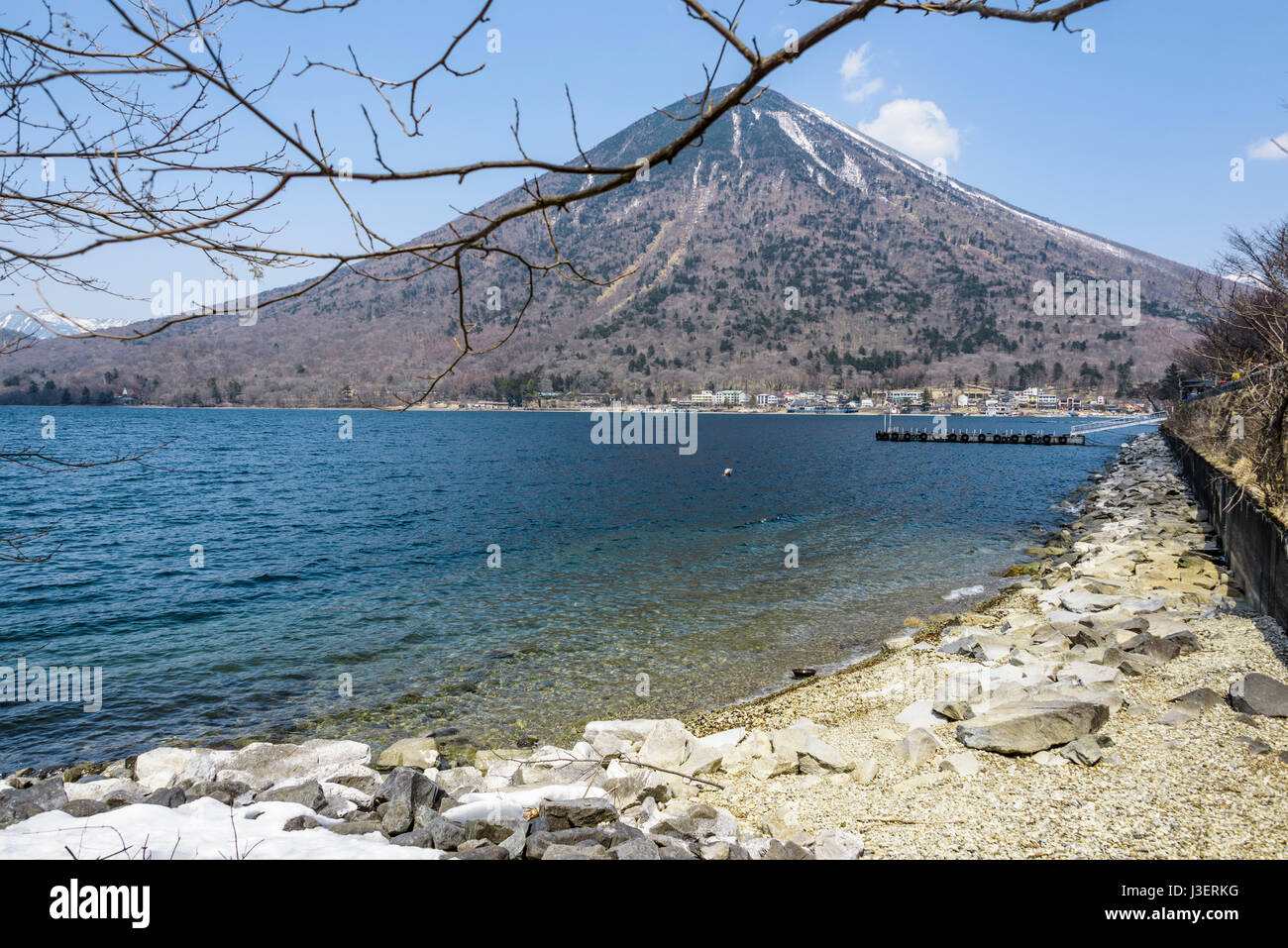 Mount Nantai and Lake Chuzenji, in spring with some snow remaining on ...