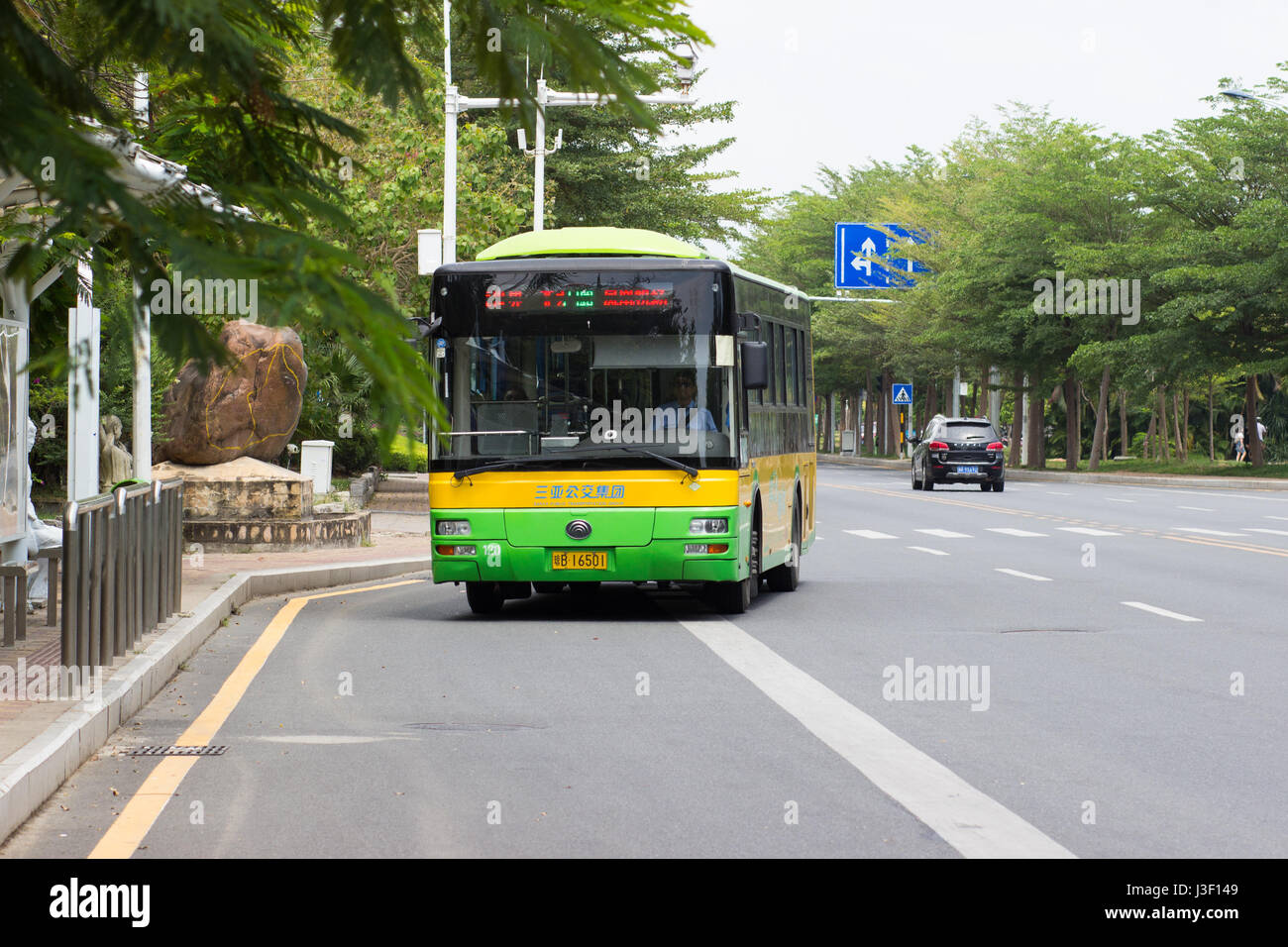Sanya, Hainan, China April 24, 2017 - A shuttle bus drives to a public ...