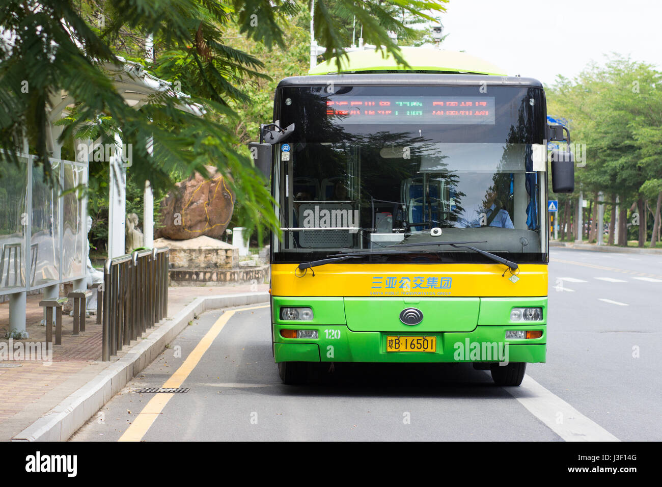 Sanya, Hainan, China April 24, 2017 - A shuttle bus drives to a public ...