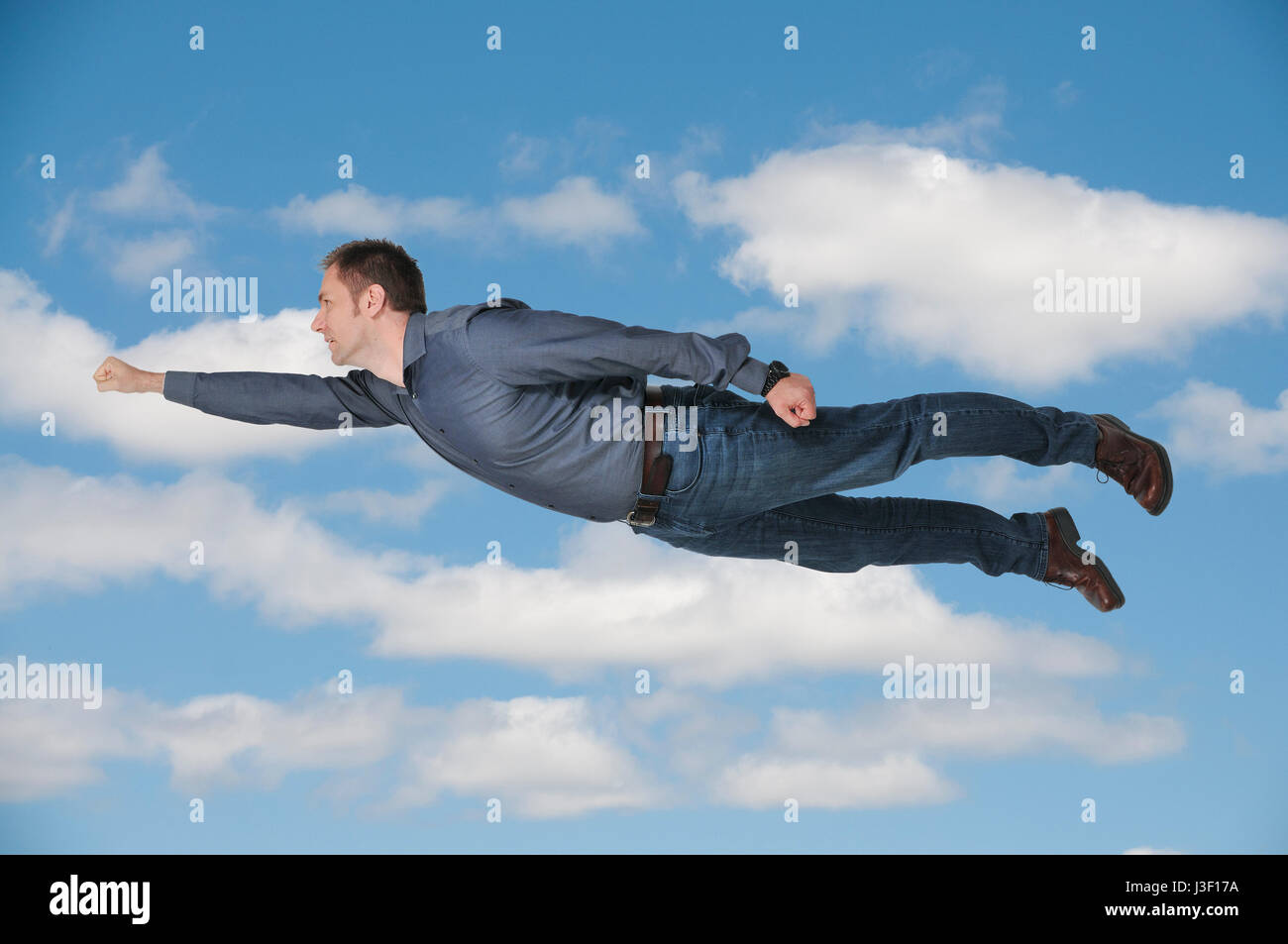 Handsome man flying or falling through the air Stock Photo - Alamy