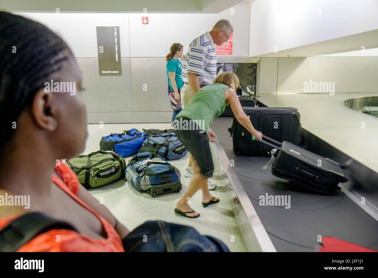Woman from international arrival hi-res stock photography and images ...