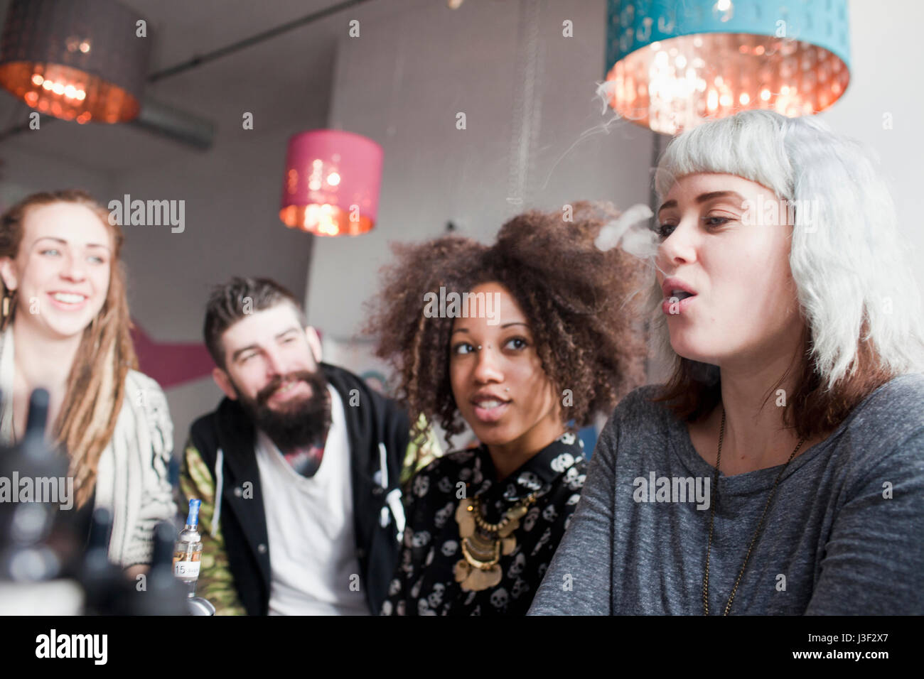 Young friends smoking Stock Photo - Alamy