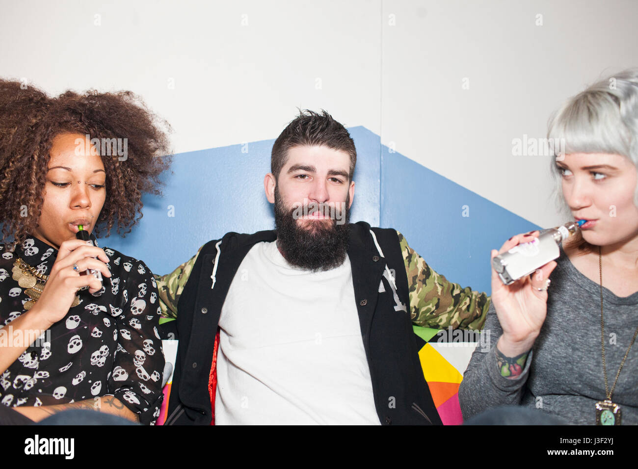 Young friends smoking Stock Photo - Alamy