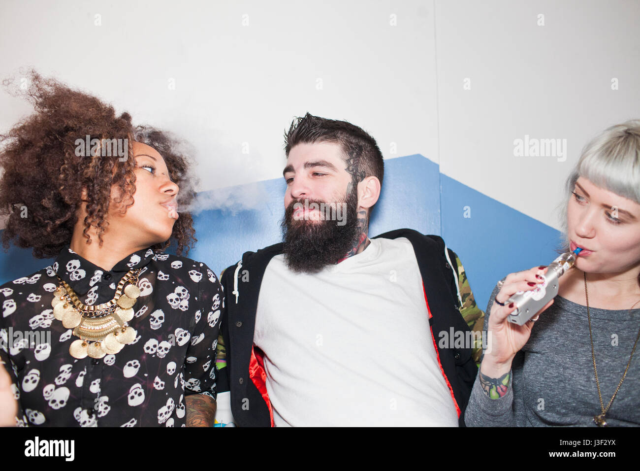 Young friends smoking Stock Photo - Alamy