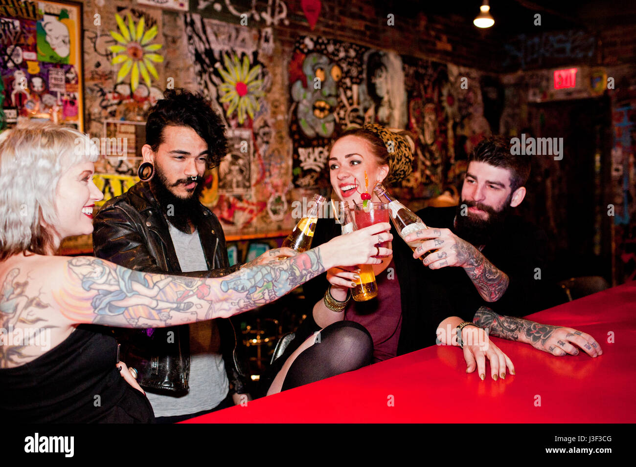 Friends hanging out at a bar Stock Photo - Alamy