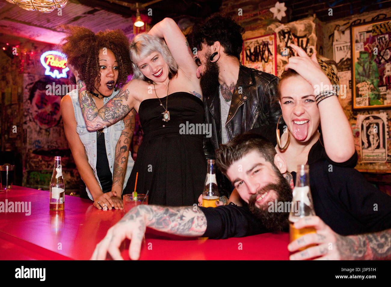 Friends hanging out at a bar Stock Photo - Alamy