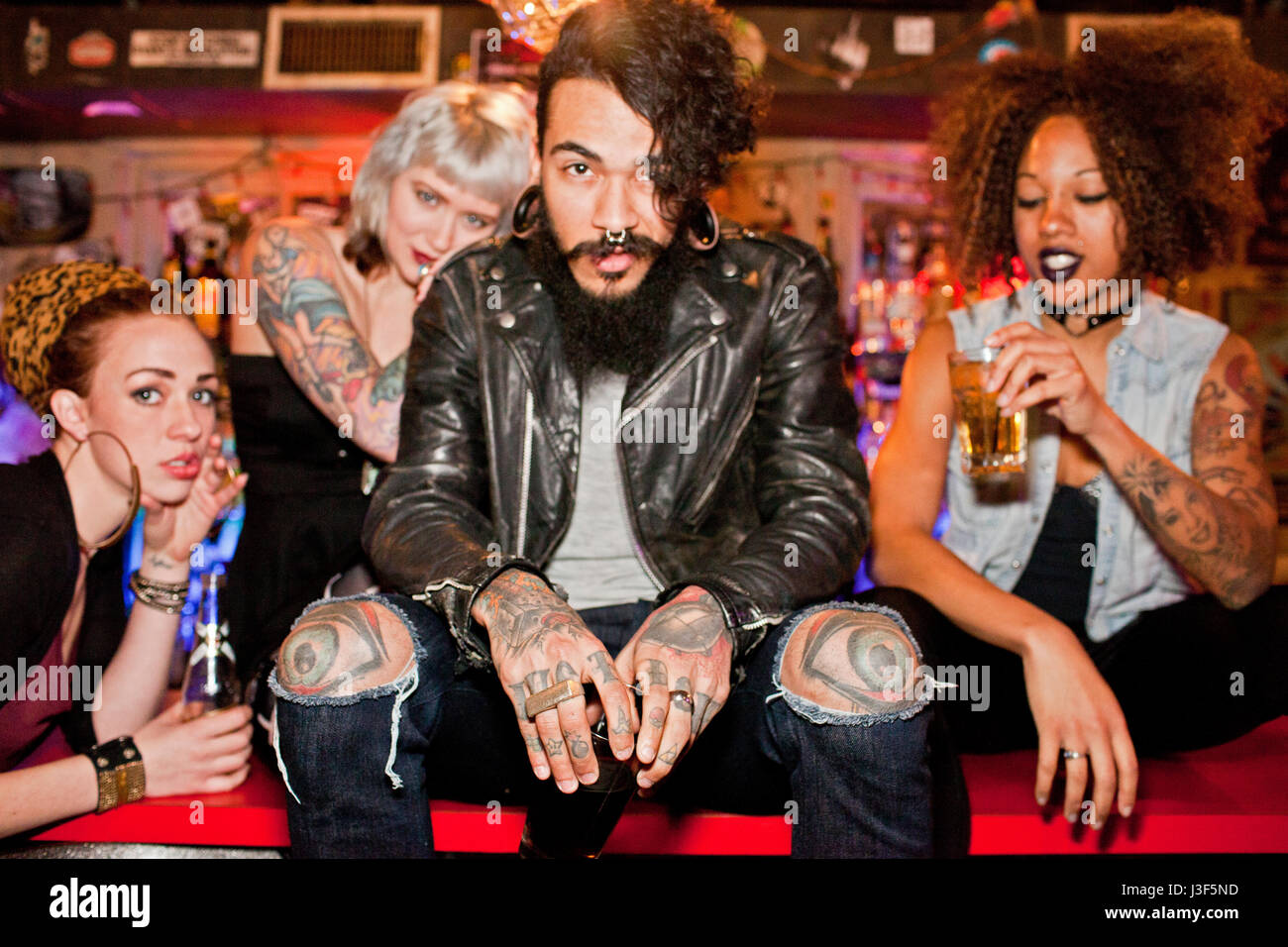 Friends hanging out at a bar Stock Photo - Alamy