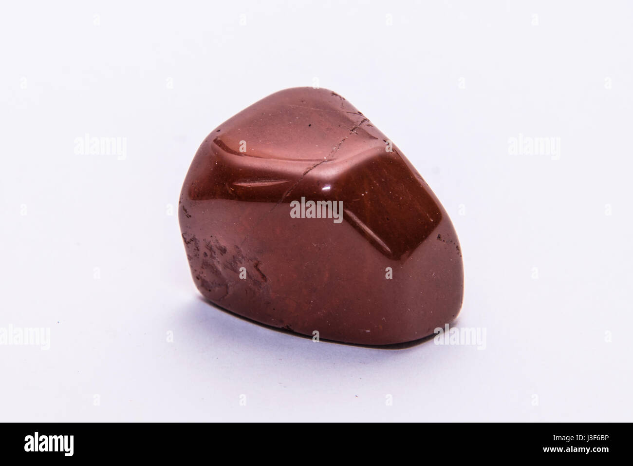 Dark red gemstone gem jewel mineral precious shiny Stock Photo - Alamy