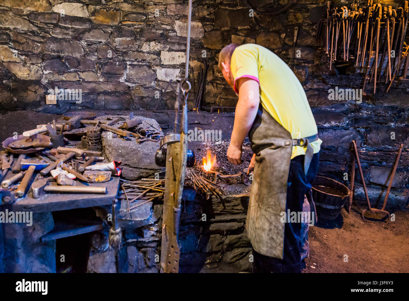 blacksmith working in the forge of Mazonovo. Mazonovo, Santa Eulalia de ...