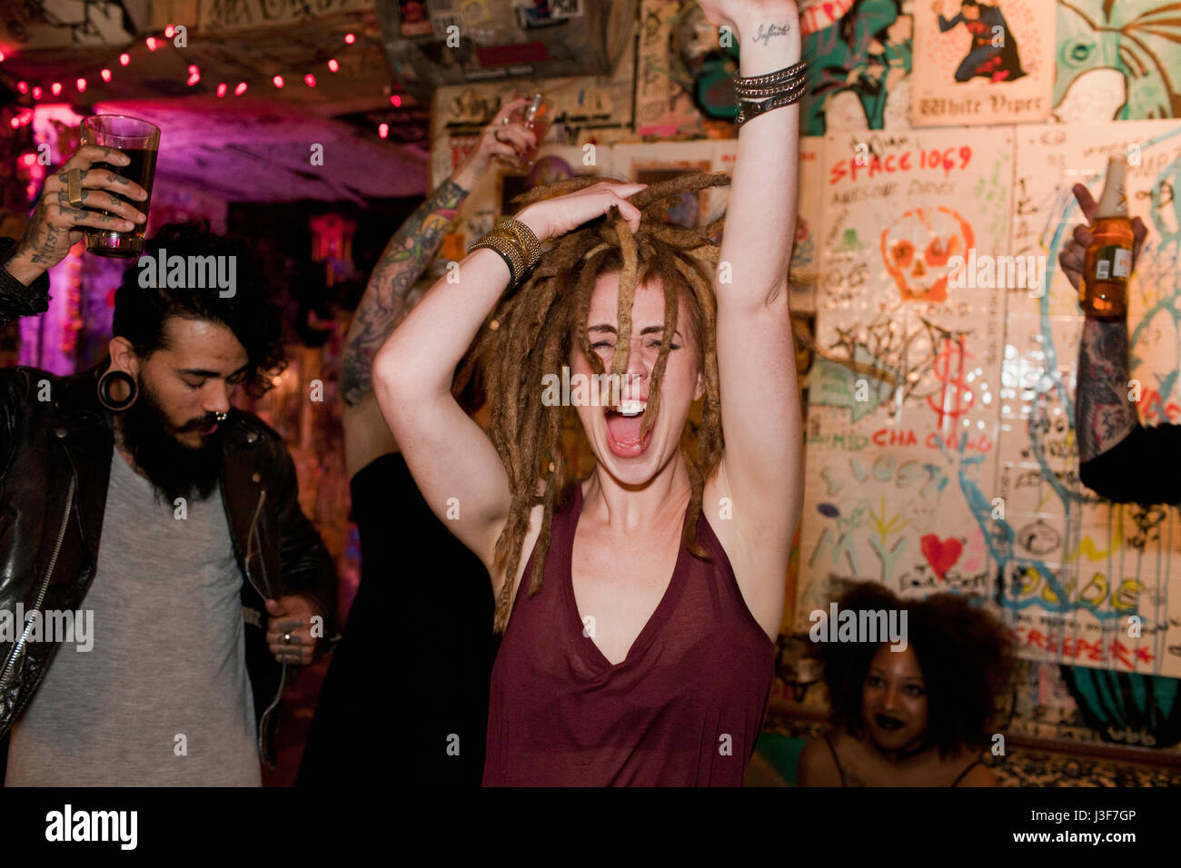 Young woman dancing at a club Stock Photo - Alamy