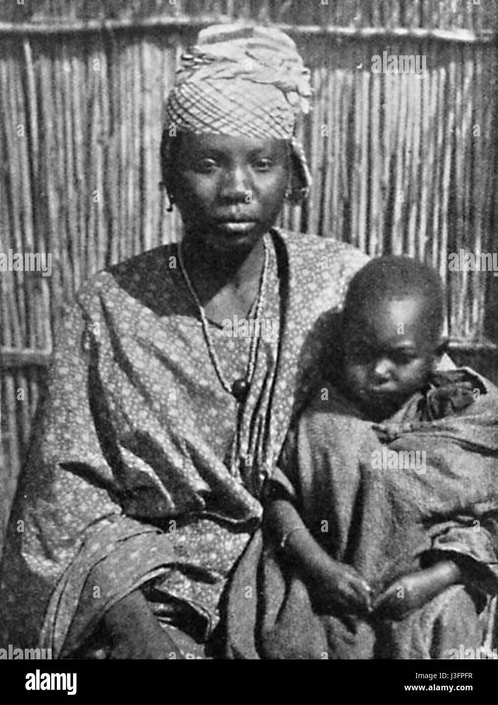 A photograph of a Wolof woman from Cayor, Senegal, taken in 1914. The ...
