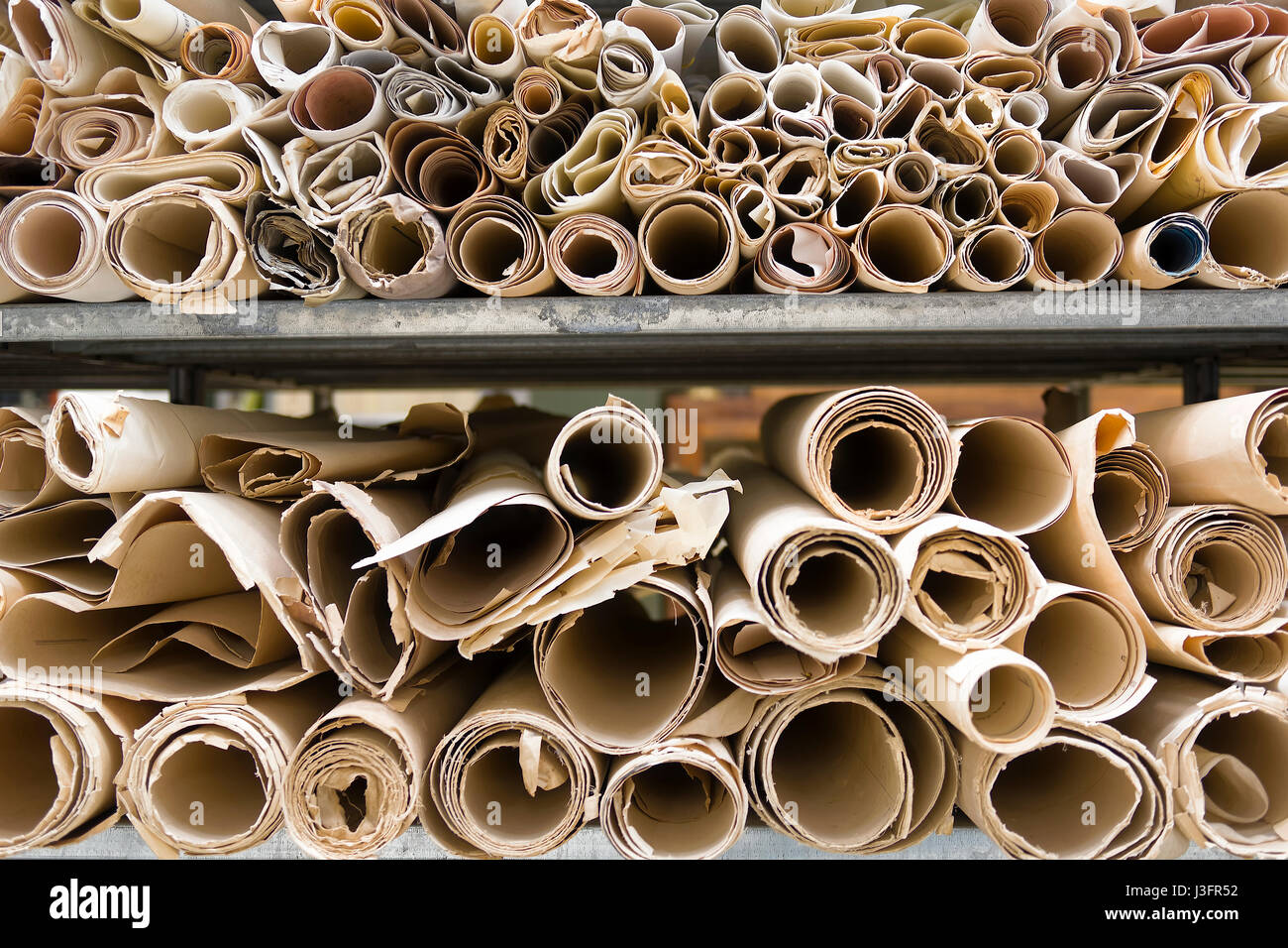 Maps rolled up cartography hi-res stock photography and images - Alamy