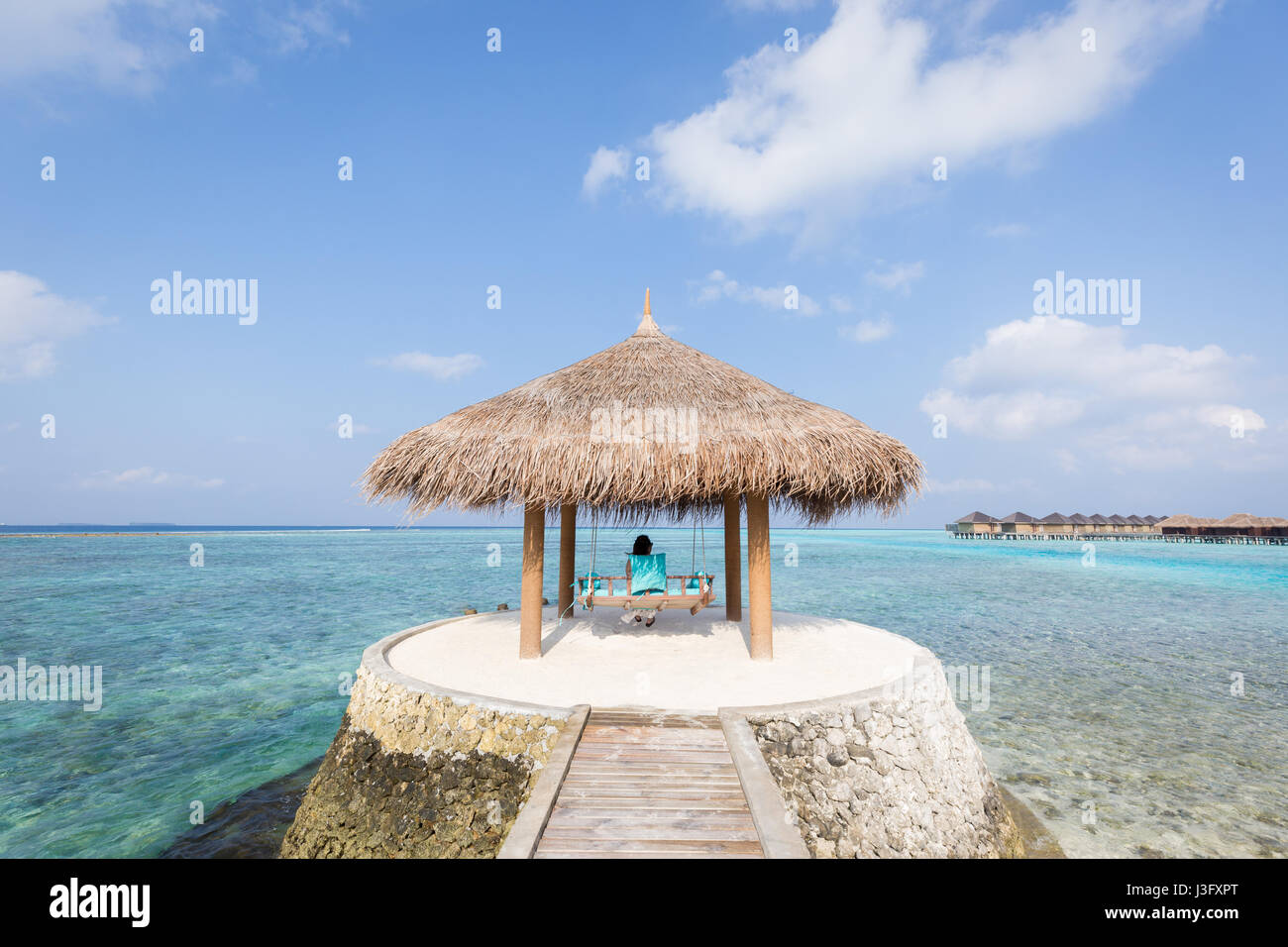 Exotic Tropical Paradise Swing under Hut over looking Over Water ...