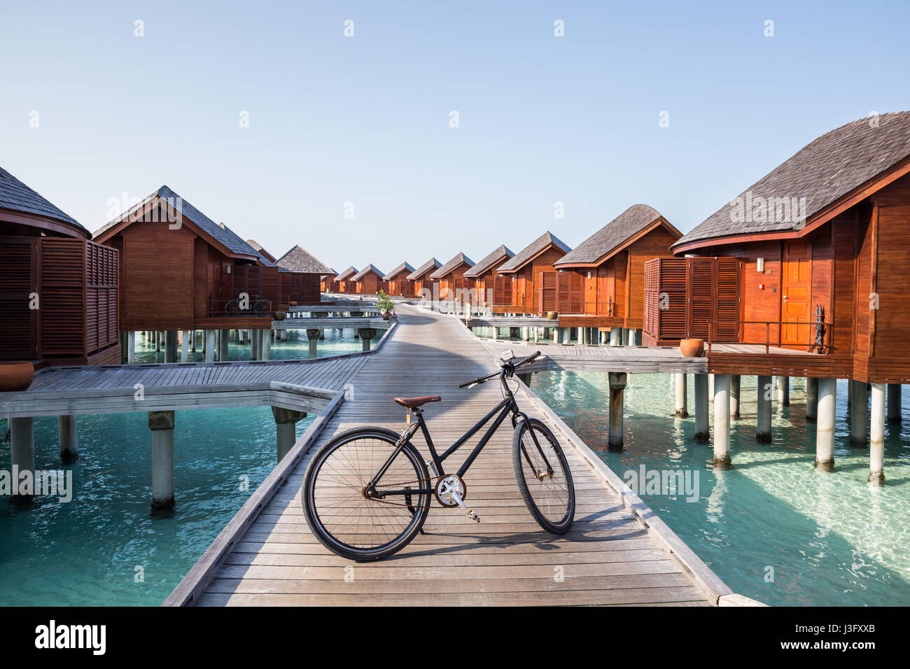 Exotic Tropical Paradise Bike Bicycle on Boardwalk Over Water Bungalow Shallow Crystal Clear ...