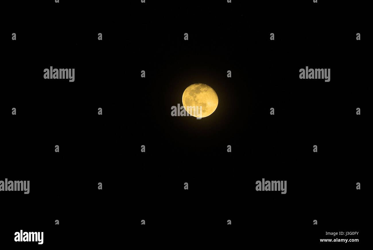 Moon with color on the dark sky at night and isolated black background ...