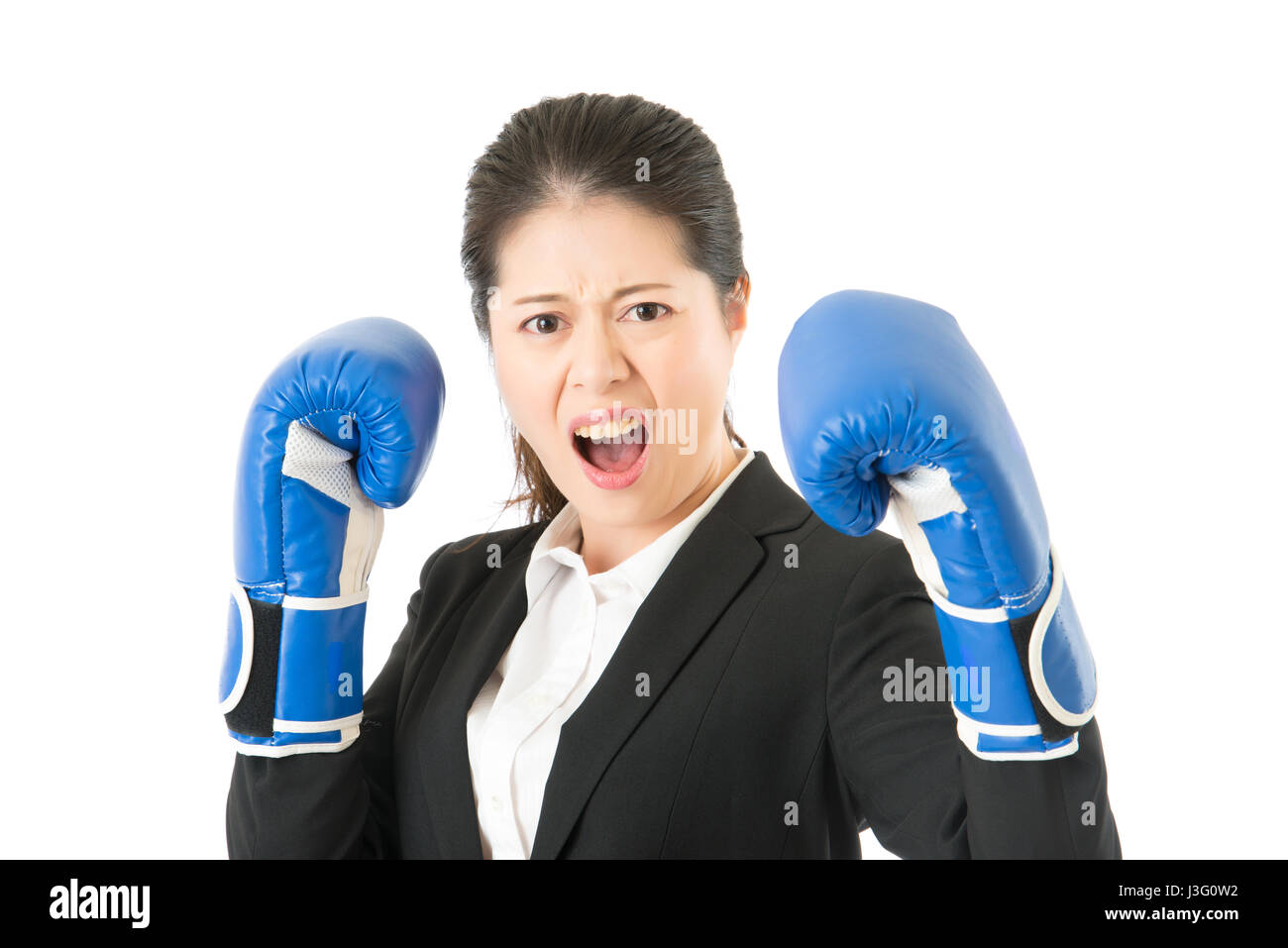 crazy businesswoman pretending to fight attack punch pose with boxing ...