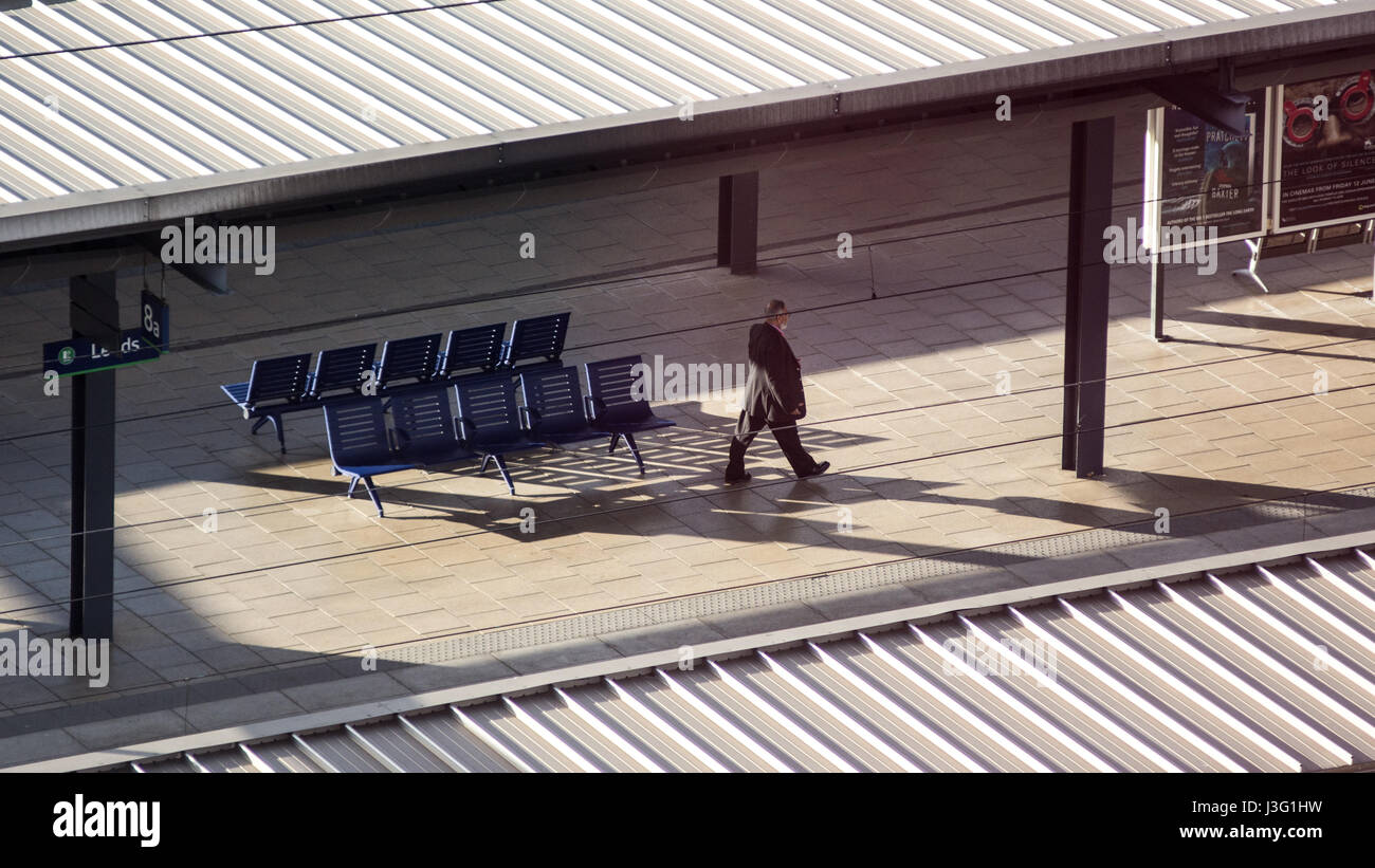 Leeds, England, UK - June 28, 2015: A man walks along a platform at ...