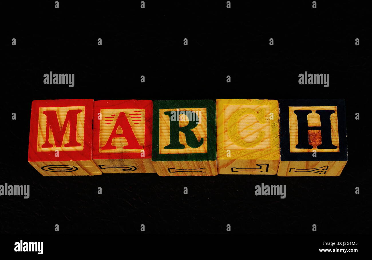 The term March visually displayed on a black background using colorful ...