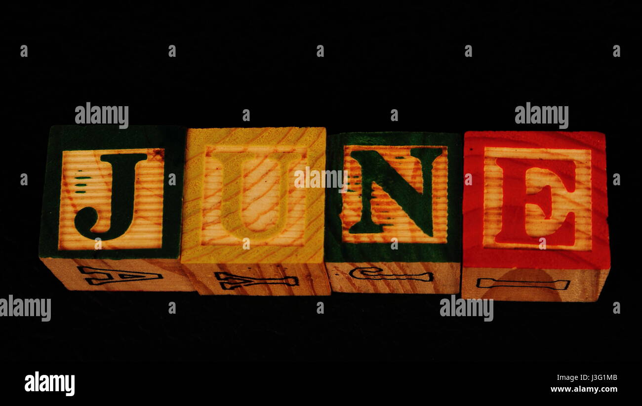The term June visually displayed on a black background using colorful ...