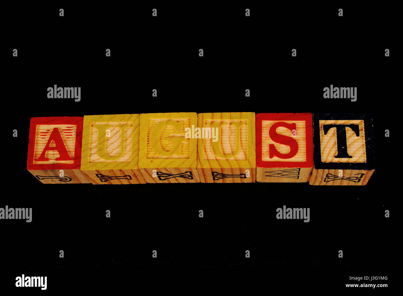 The term August visually displayed on a black background using colorful ...