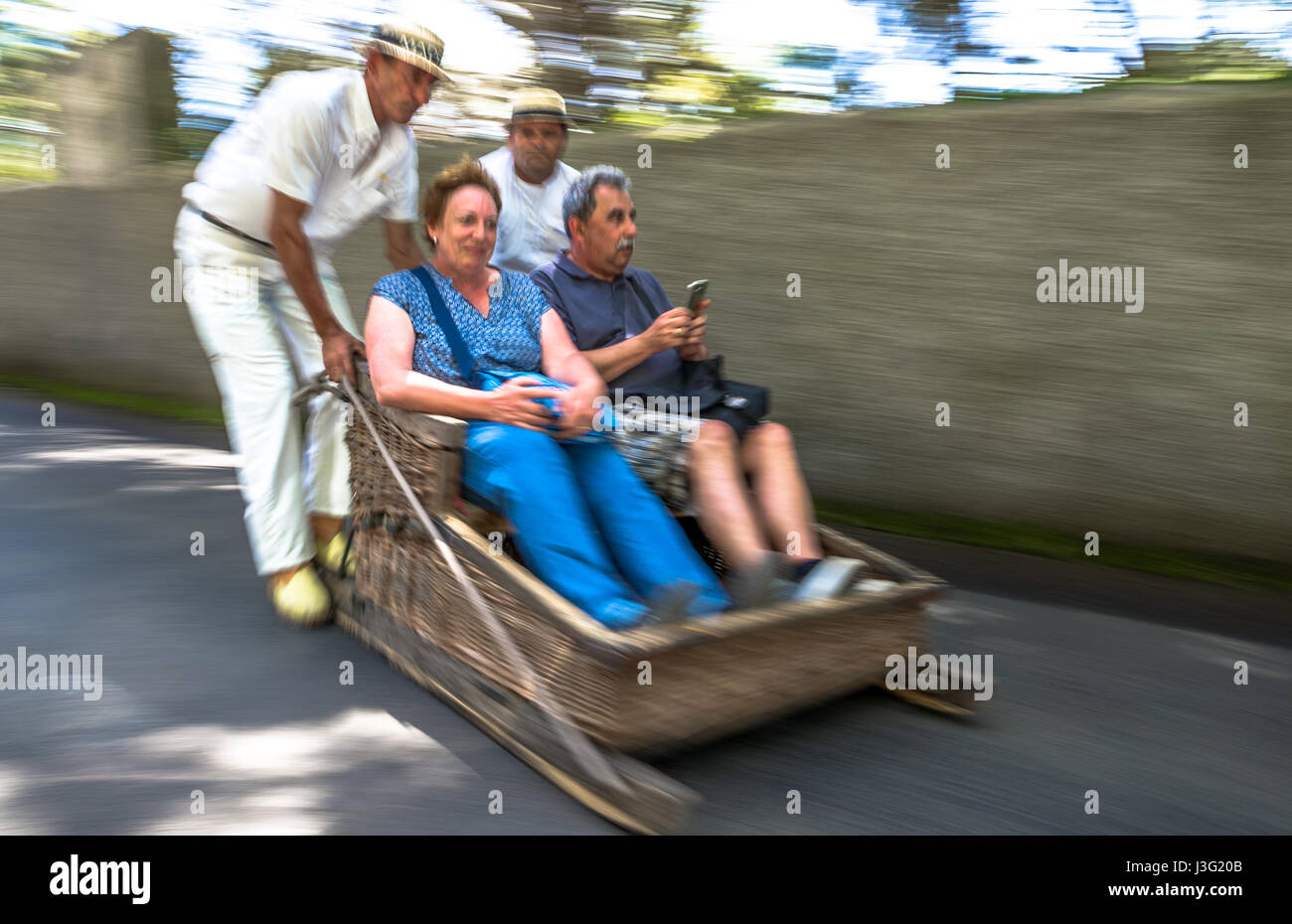 The traditional wicker basket toboggan used to carry tourist down from ...