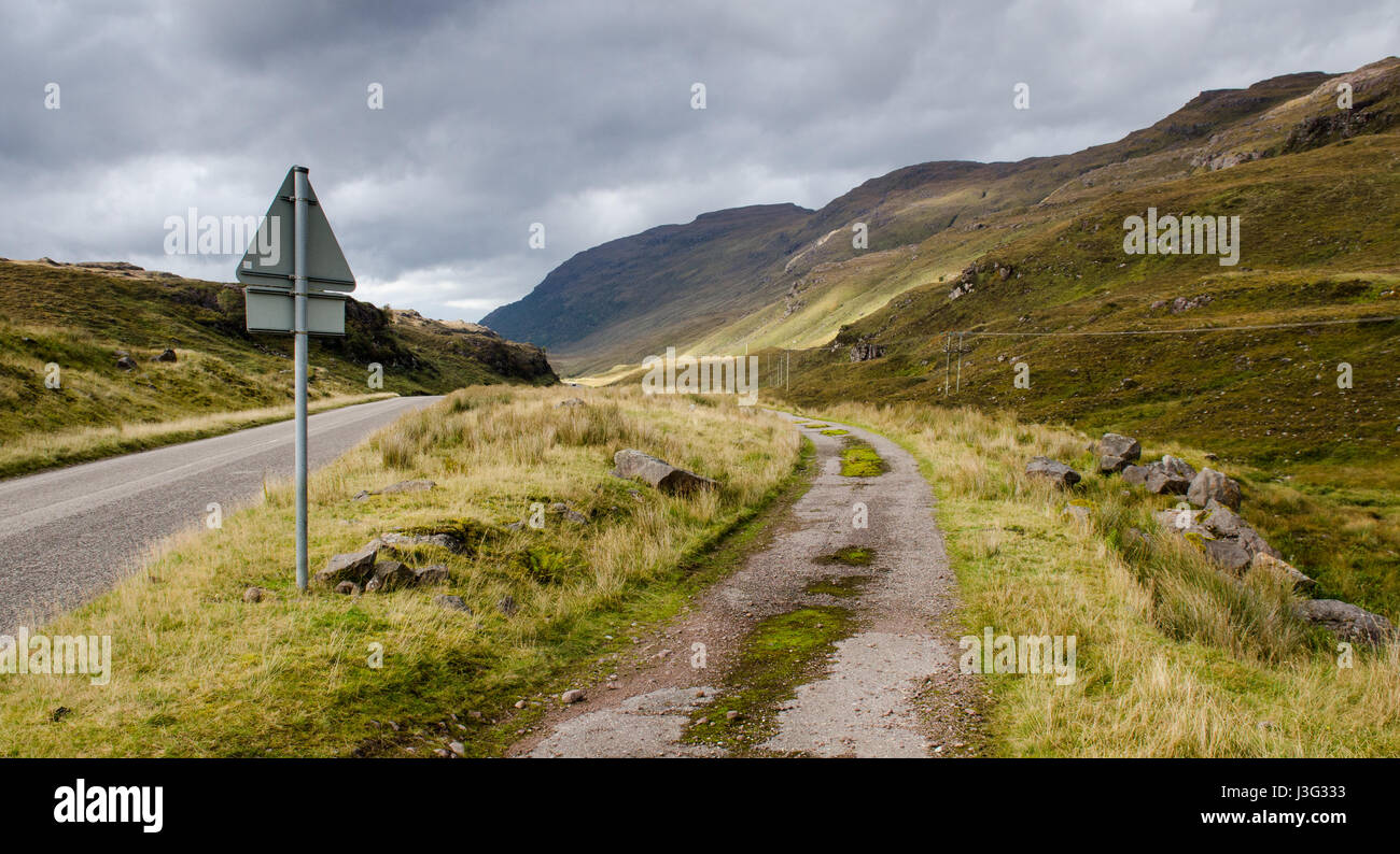 The A896 road meanders through the moorland valley of Glen Shieldaig ...