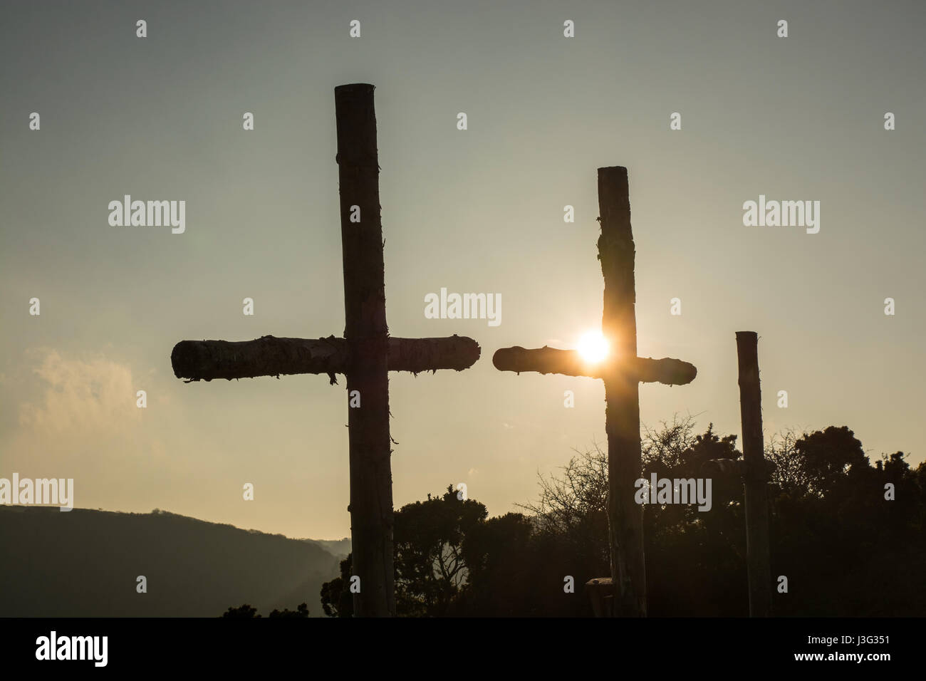 Three rugged wooden crosses in the sunset Stock Photo - Alamy